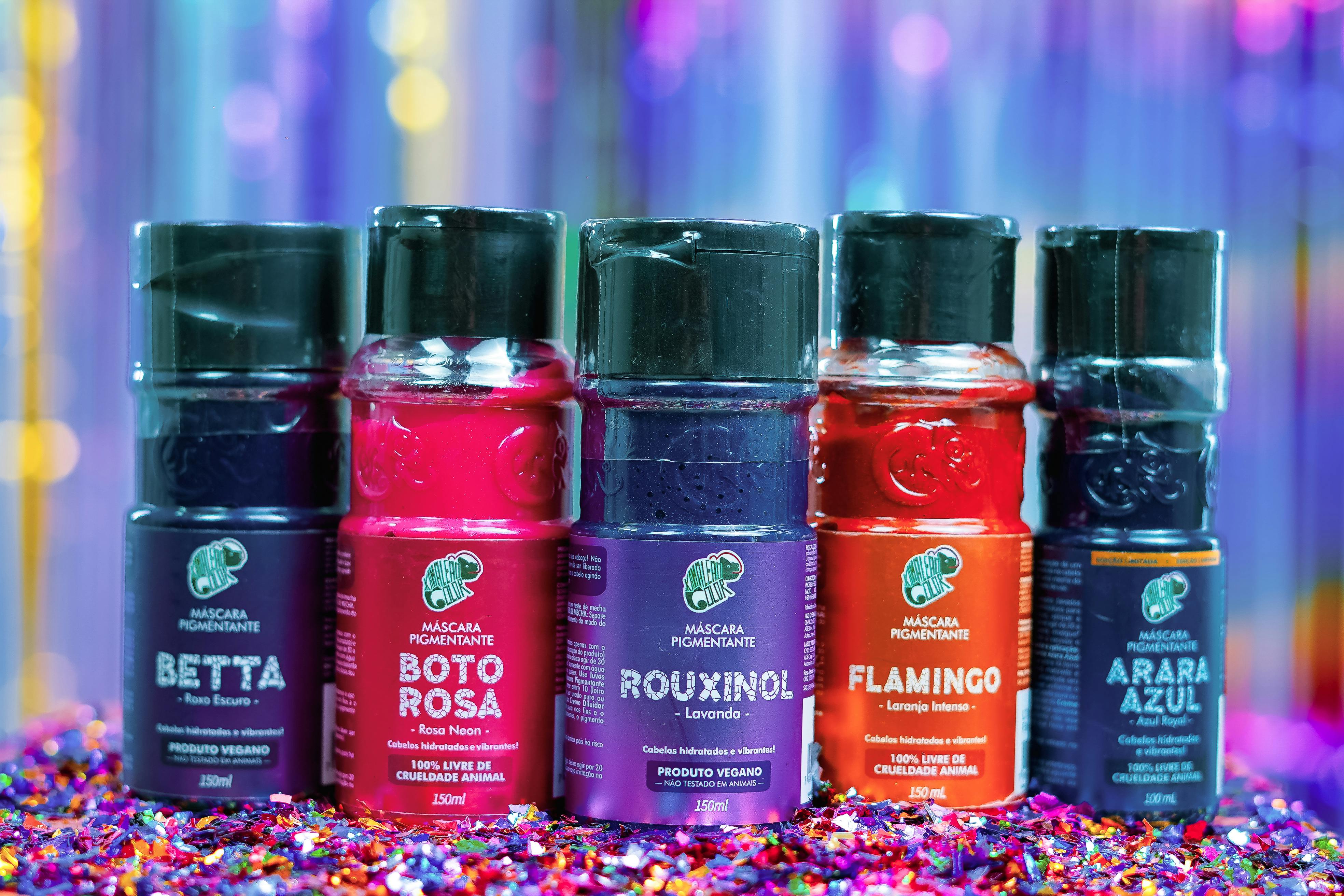 Colorful Hair Dye Bottles with Vibrant Background · Free Stock Photo