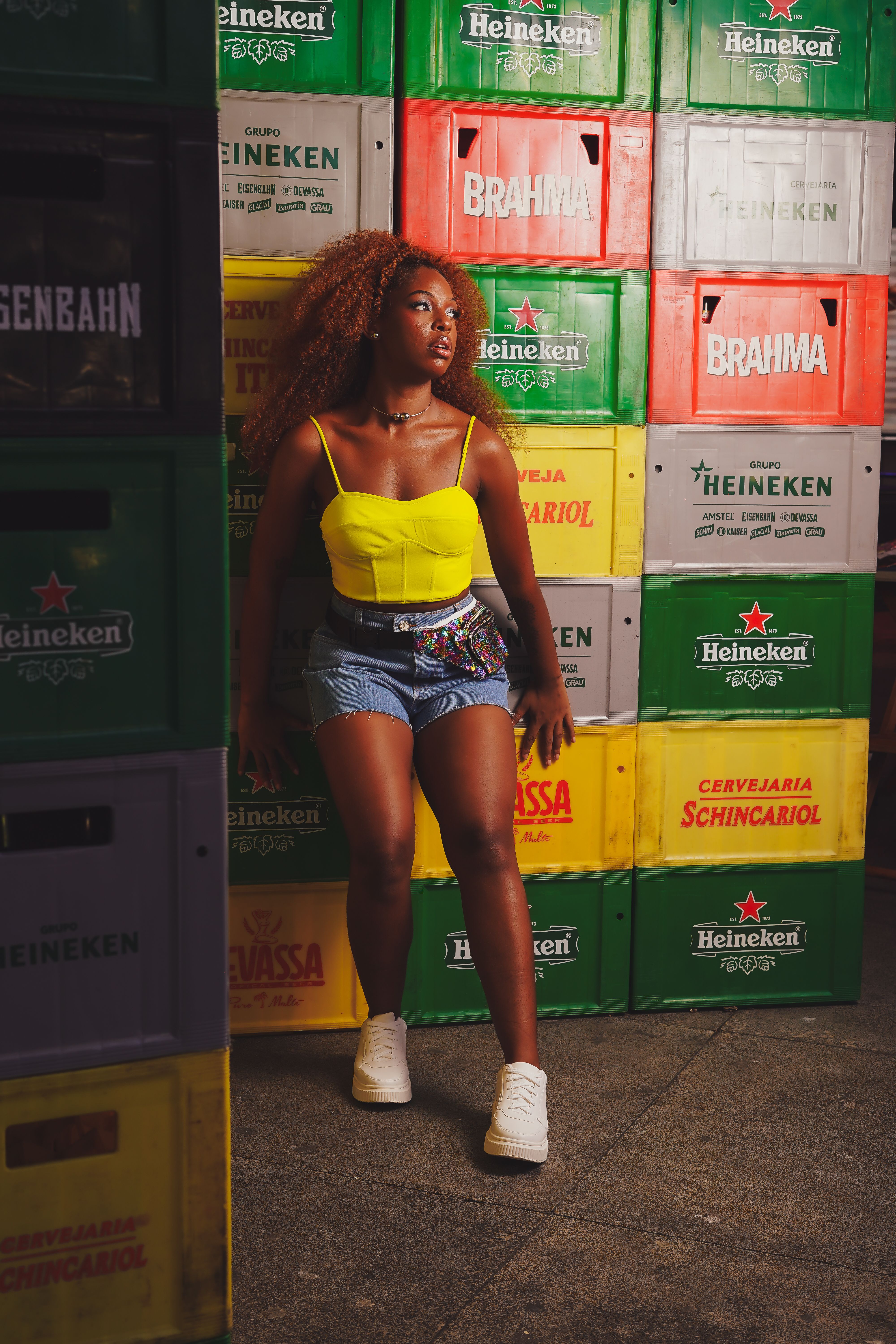 Stylish Woman Posing by Colorful Beer Crates · Free Stock Photo