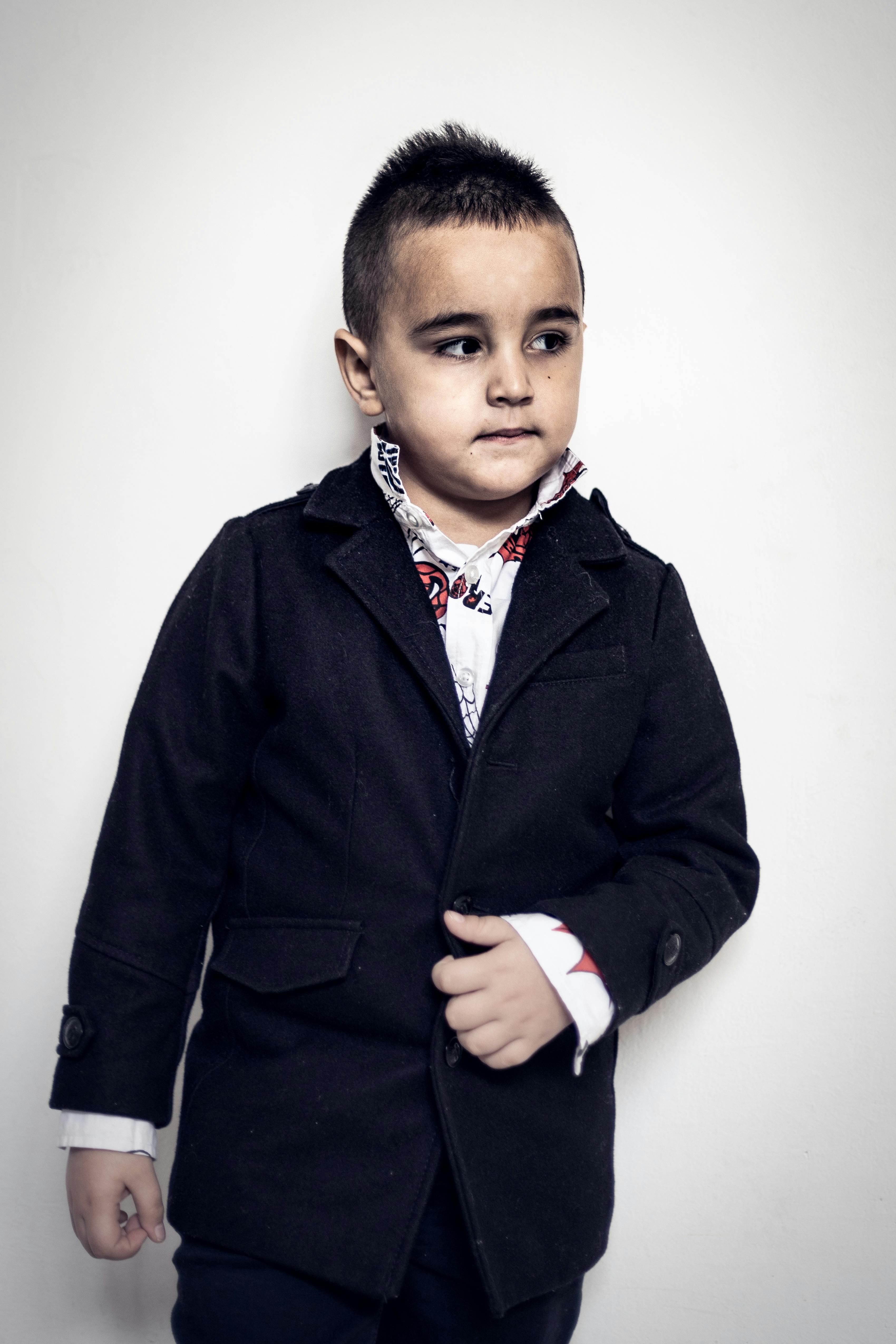 Stylish Young Boy in Classic Attire · Free Stock Photo