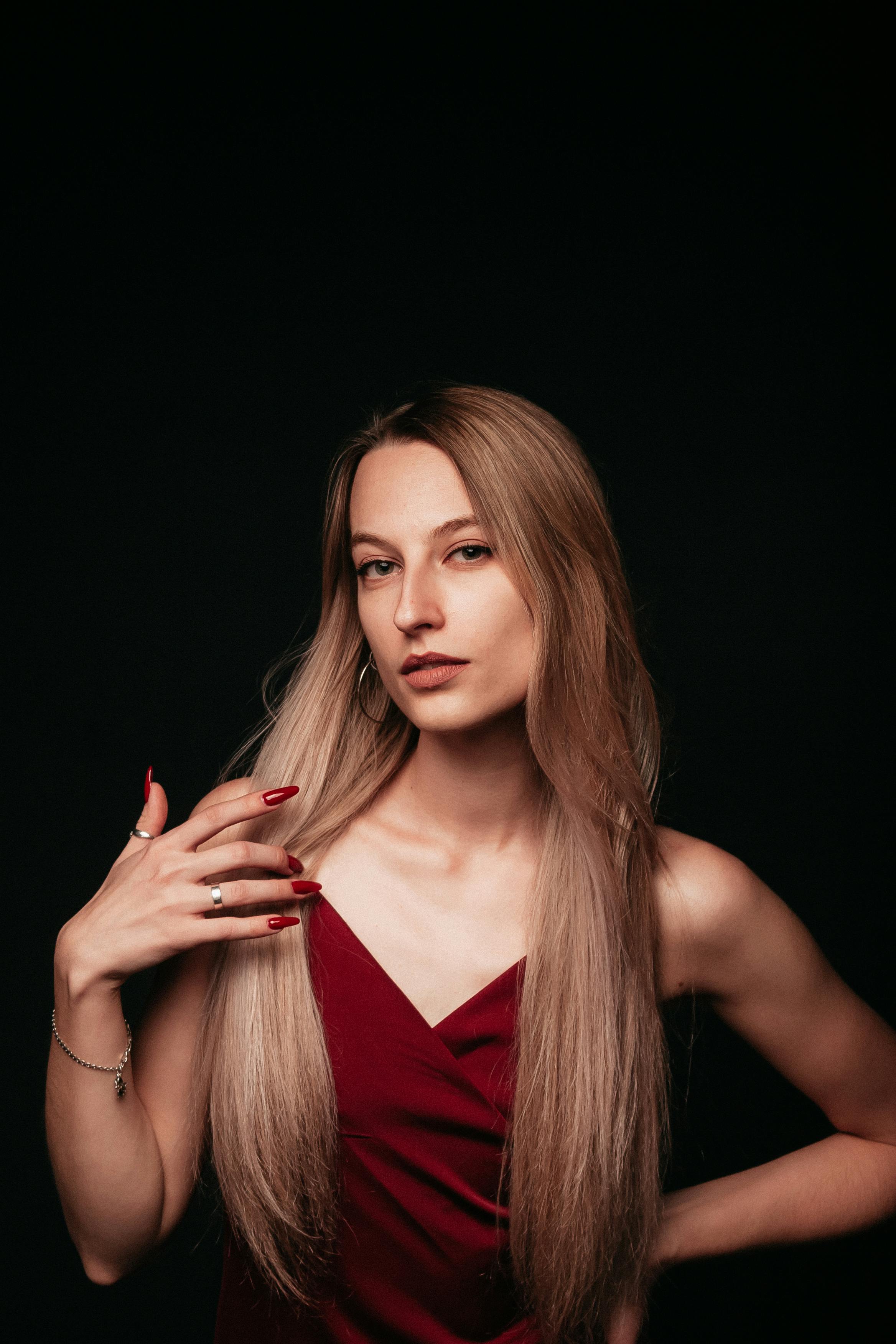 Elegant Woman in Red Dress Posing Confidently · Free Stock Photo