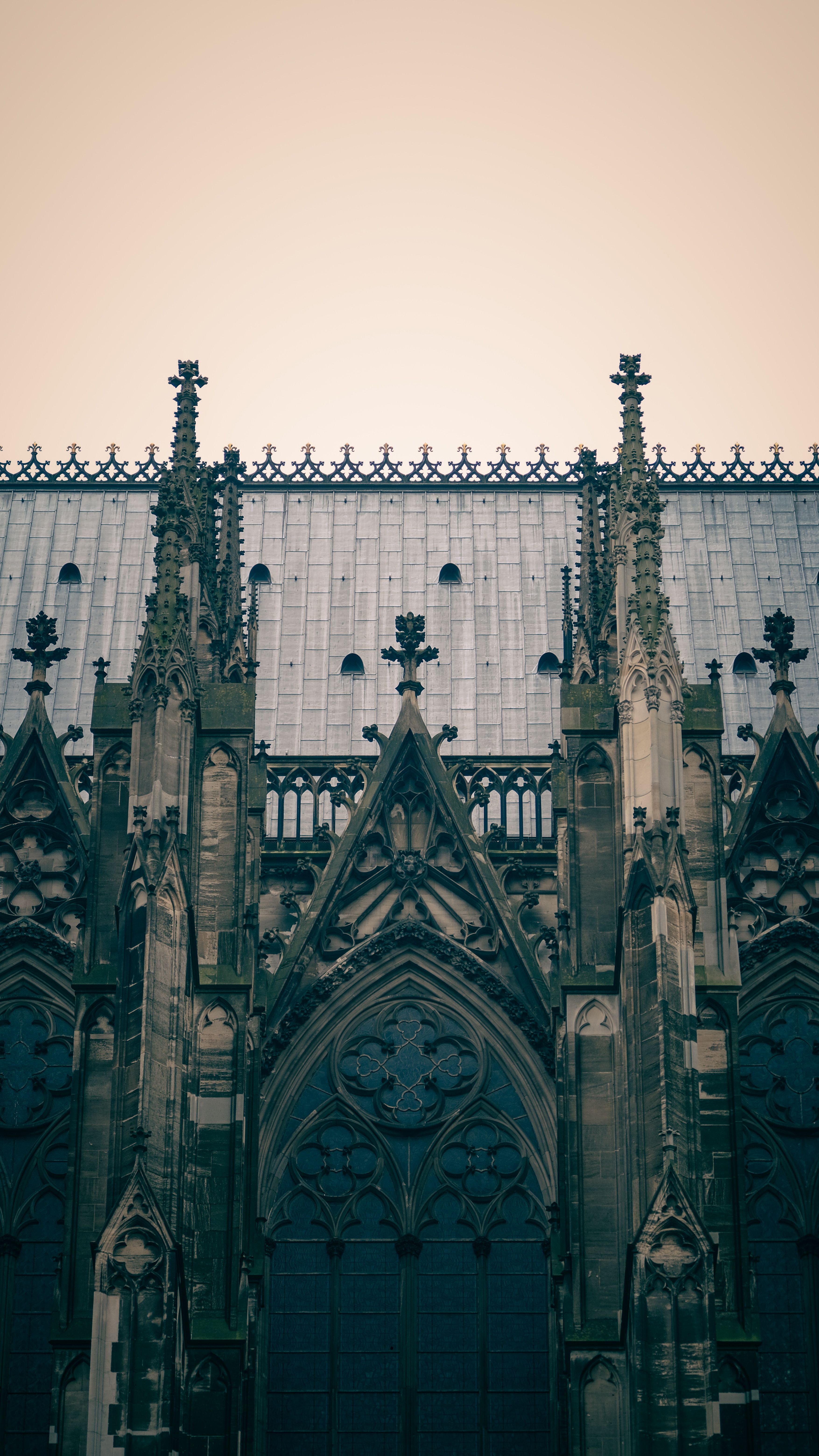 Gothic Cathedral Facade with Detailed Spires · Free Stock Photo
