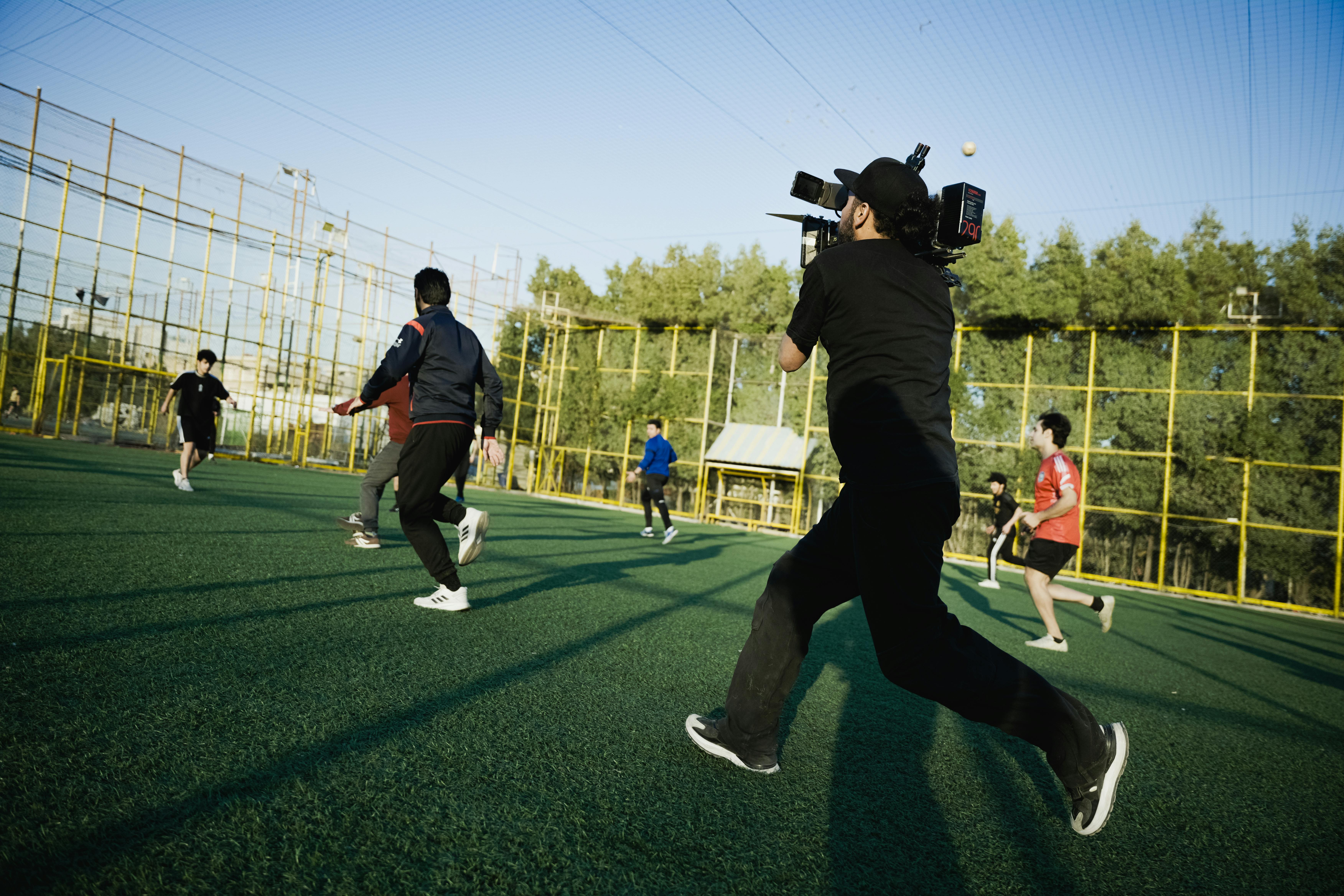 Camera Crew Filming Outdoor Soccer Match · Free Stock Photo