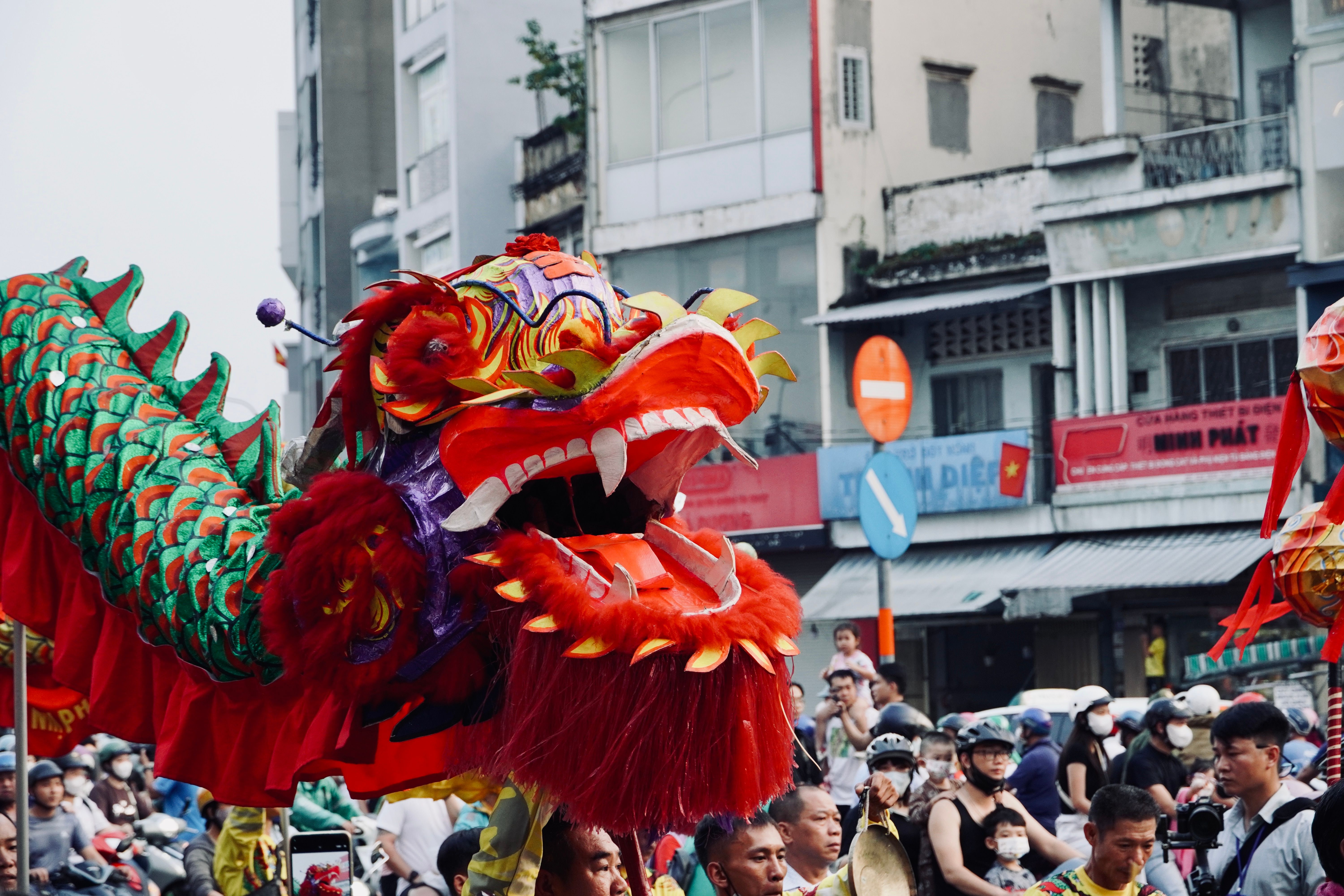 Vibrant Dragon Dance Celebration in City Street · Free Stock Photo