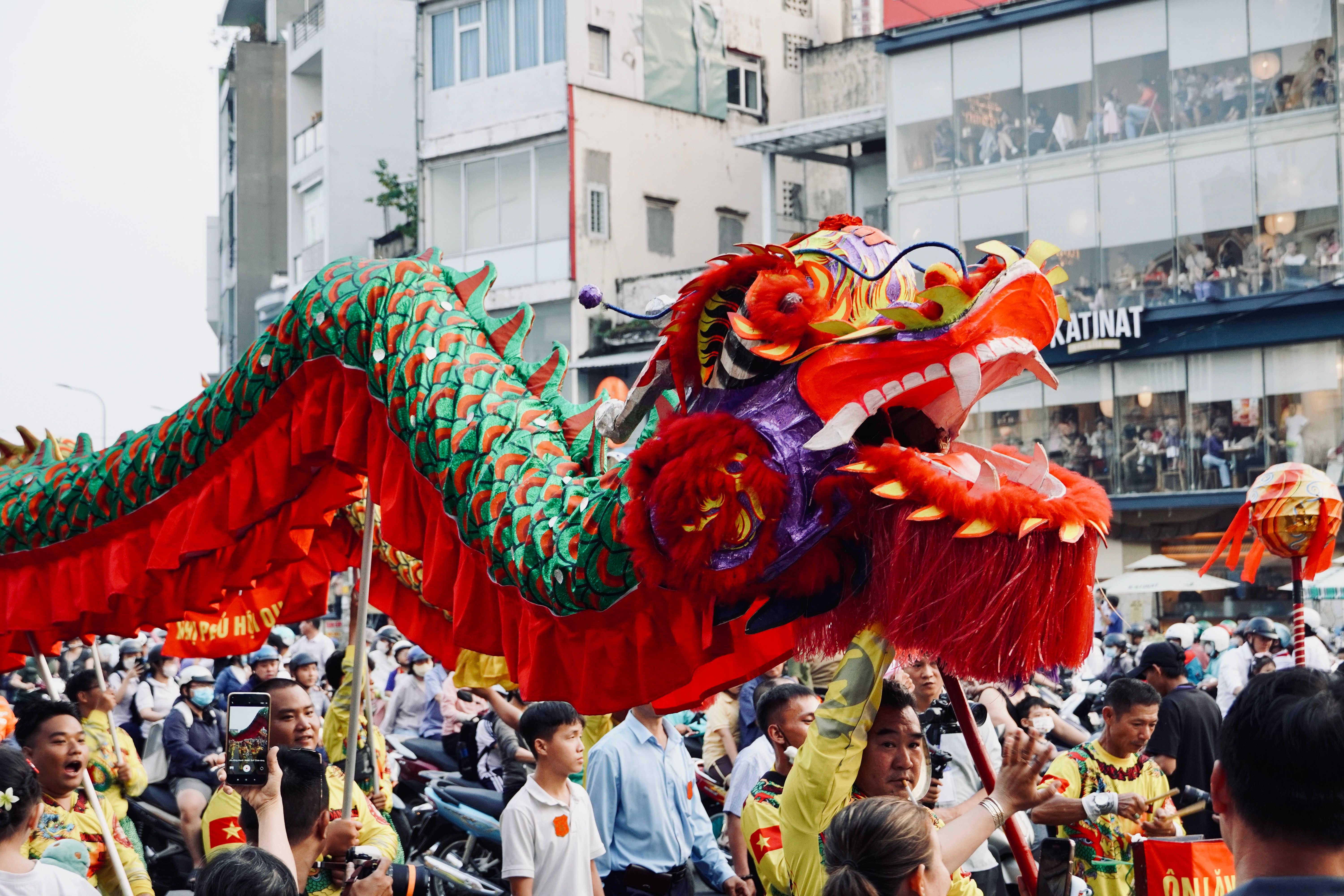 Colorful Dragon Dance Parade in Urban Setting · Free Stock Photo
