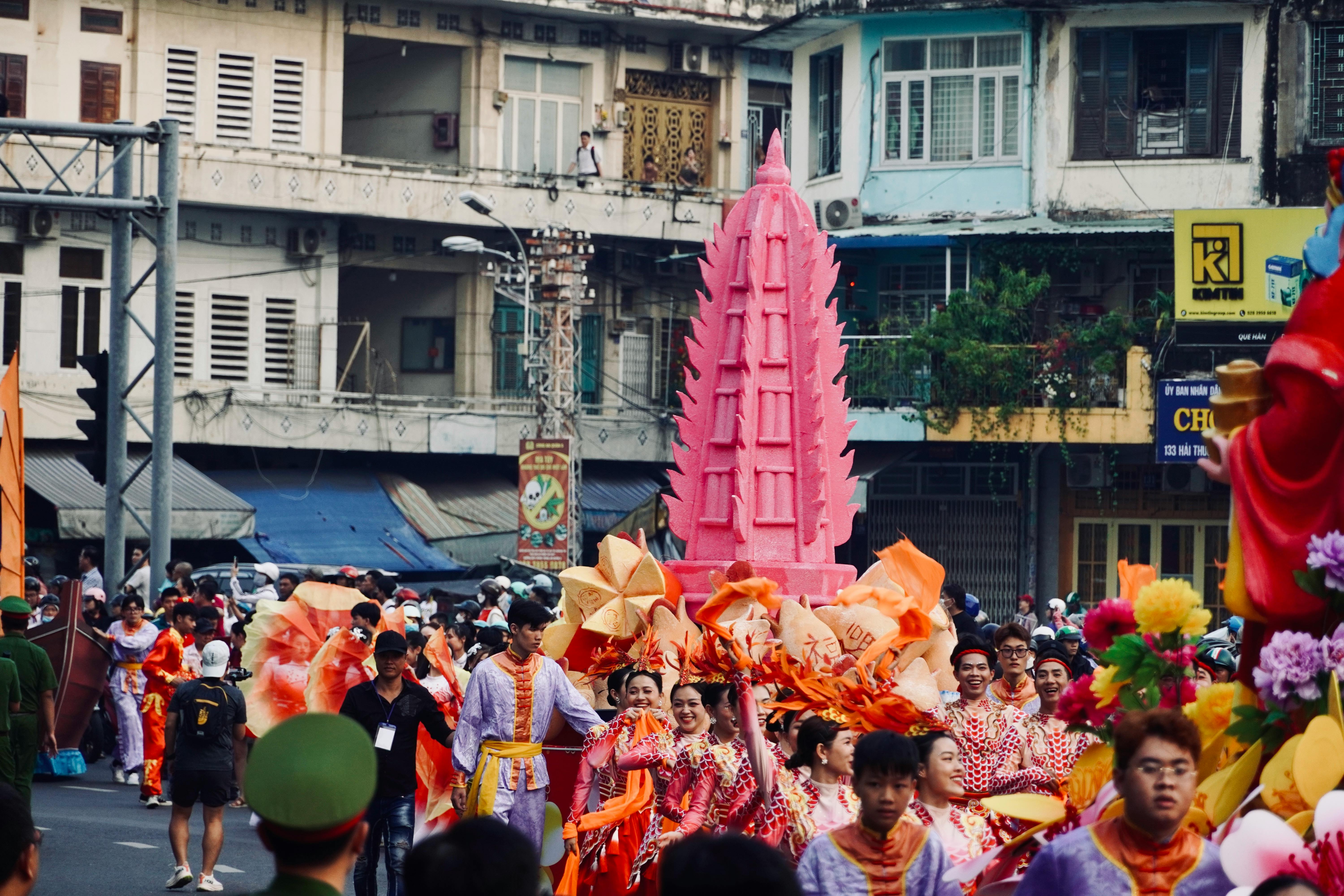 Colorful Parade in Bustling City Street Scene · Free Stock Photo