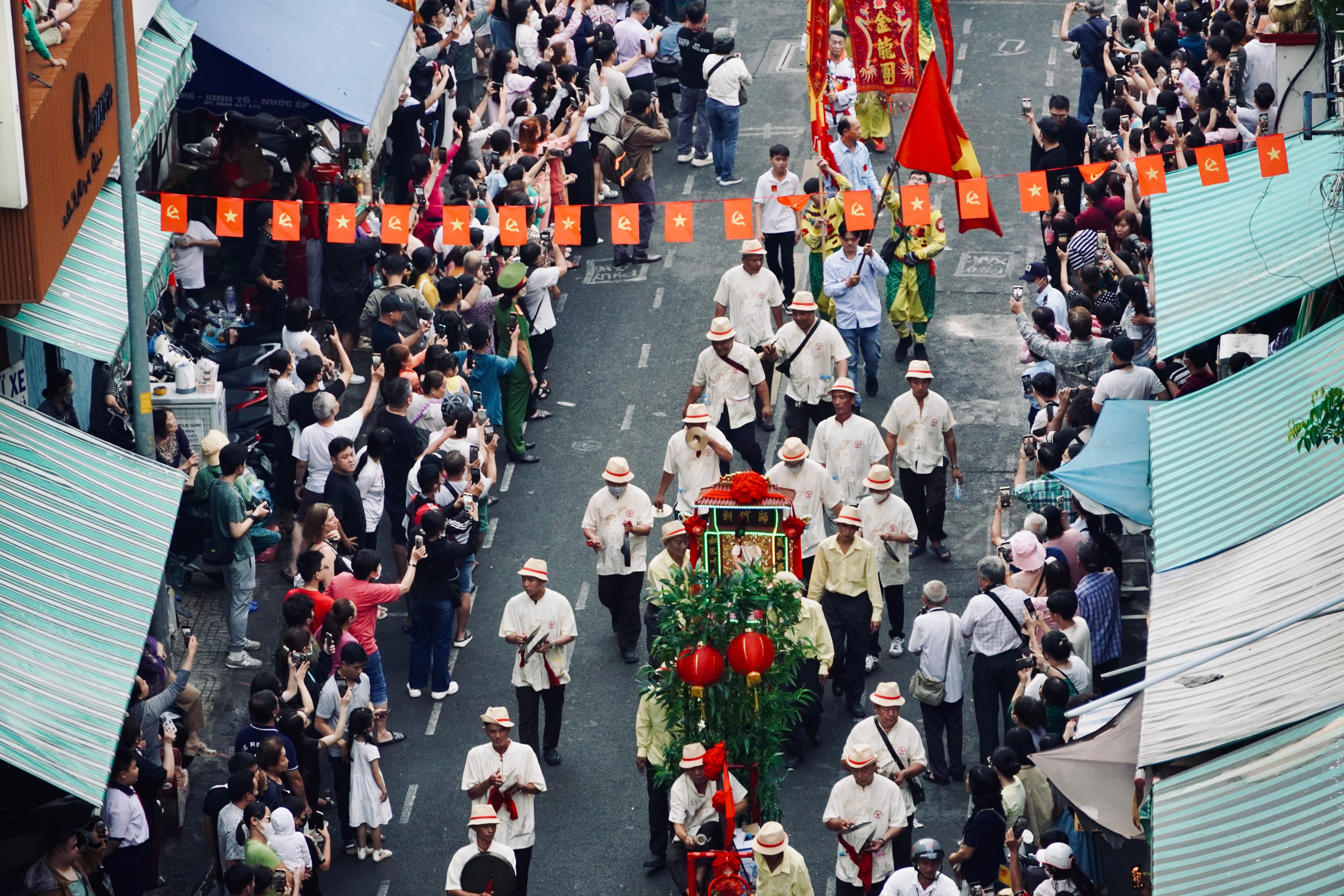 Colorful Cultural Parade on Bustling Street · Free Stock Photo