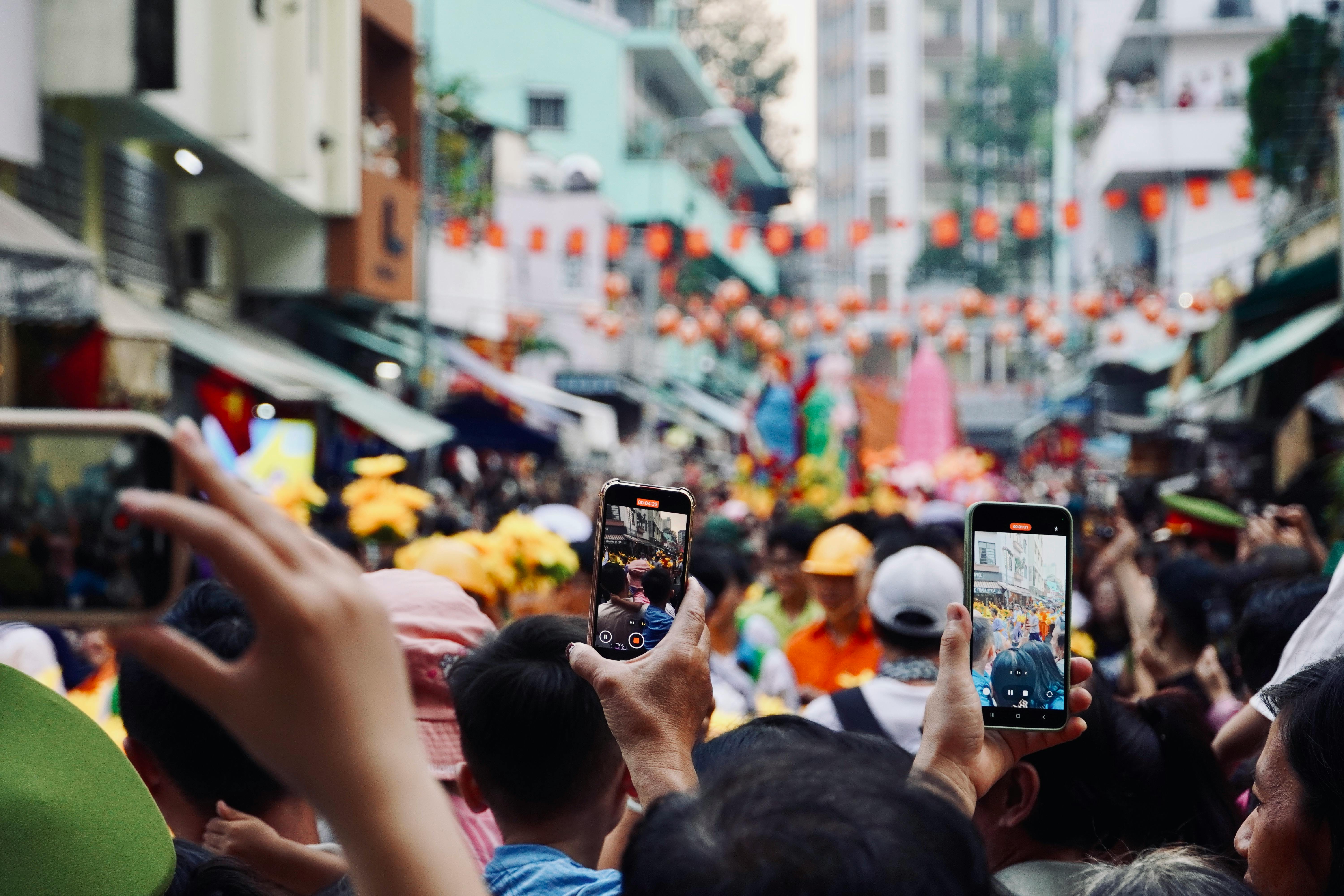 Crowded Street Festival Captured by Smartphones · Free Stock Photo