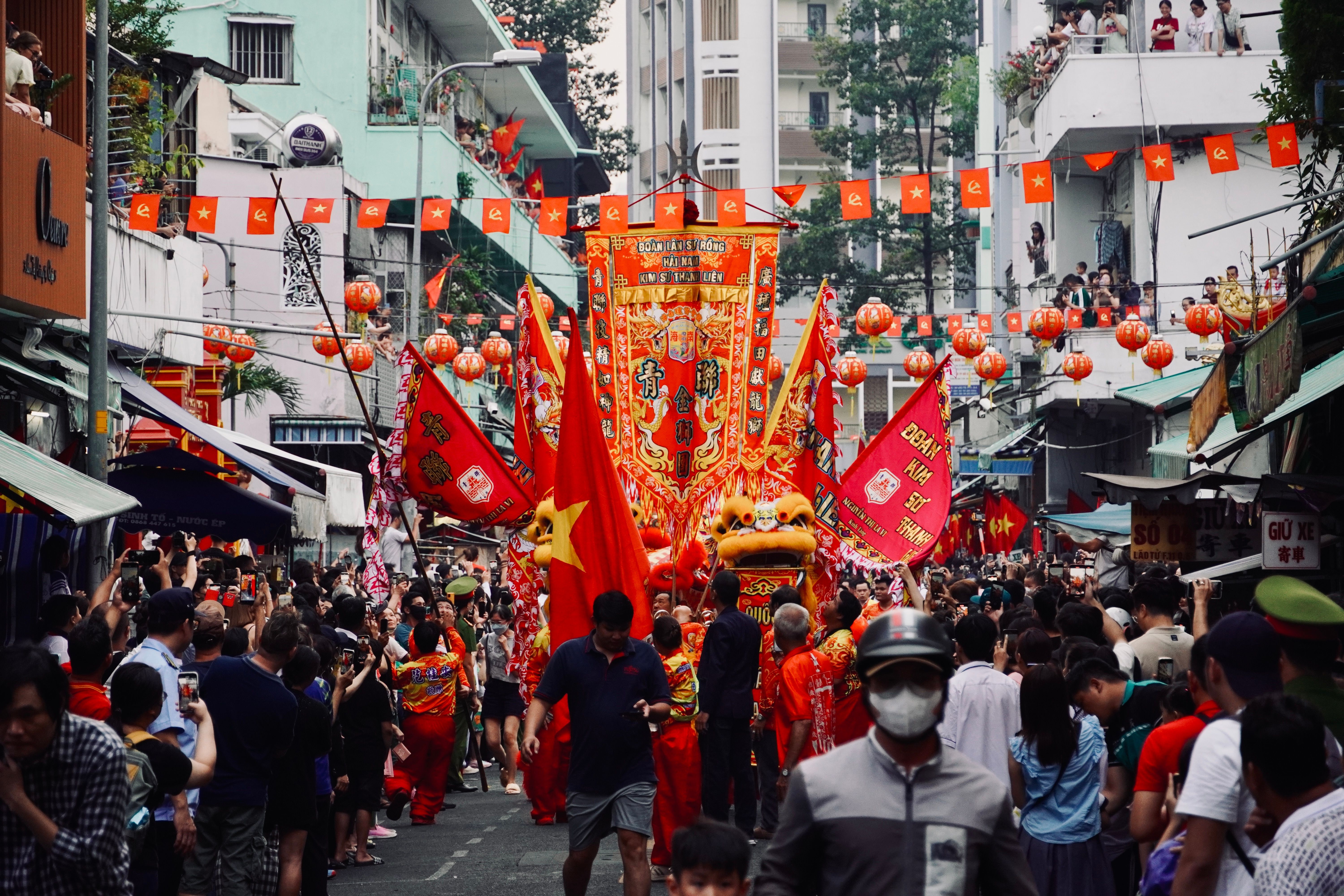 Vibrant Lion Dance Parade in Asian Street Festivity · Free Stock Photo