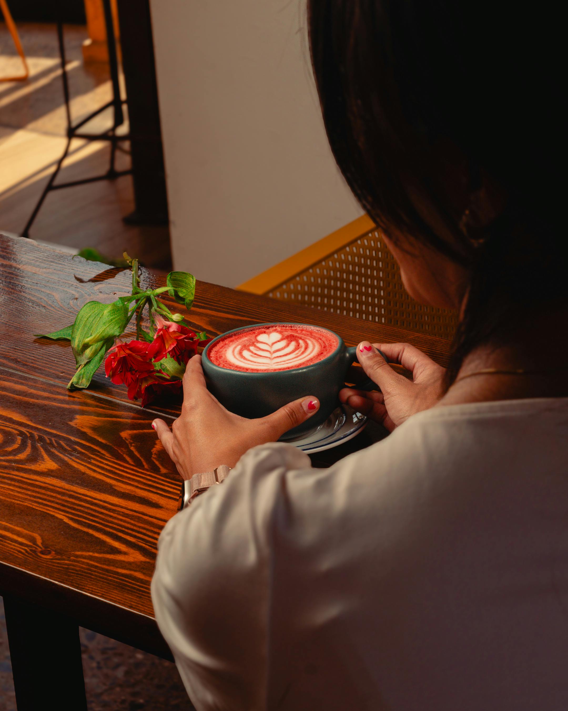 Woman Enjoying Beetroot Latte in Cozy Cafe · Free Stock Photo