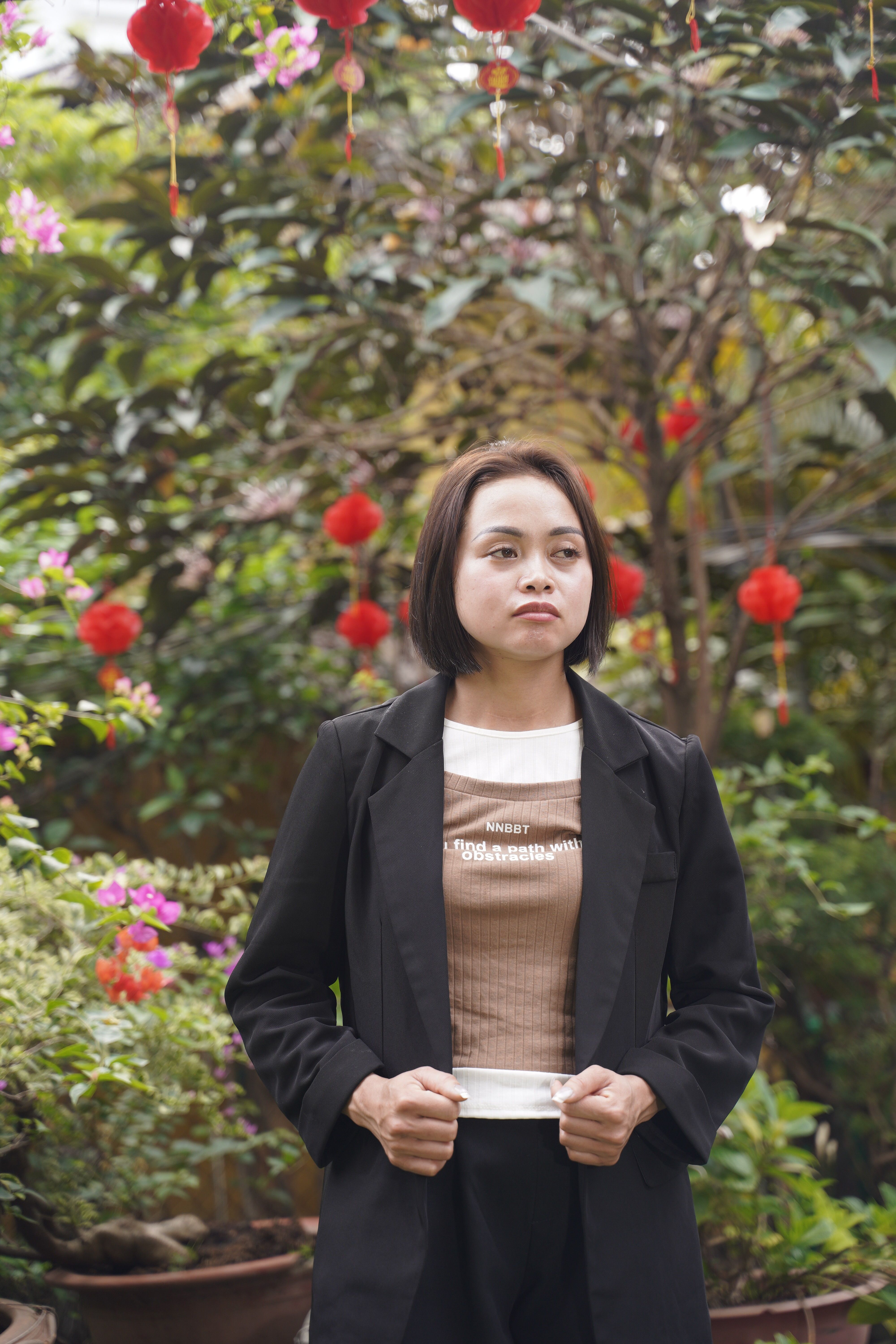 Young Woman in Garden with Red Lanterns · Free Stock Photo