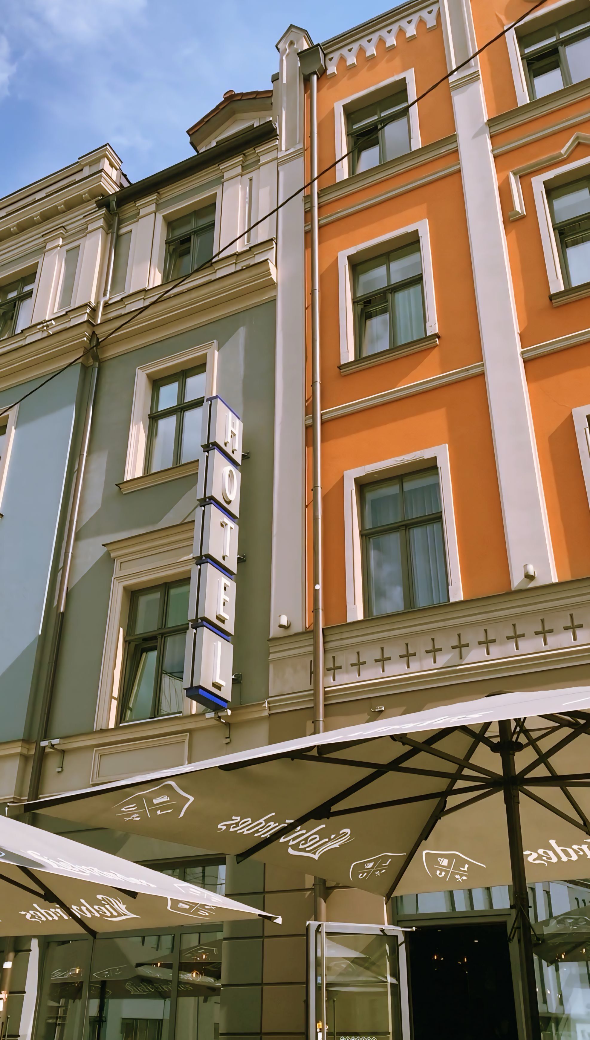 Colorful European Hotel Exterior in Sunny Weather · Free Stock Photo