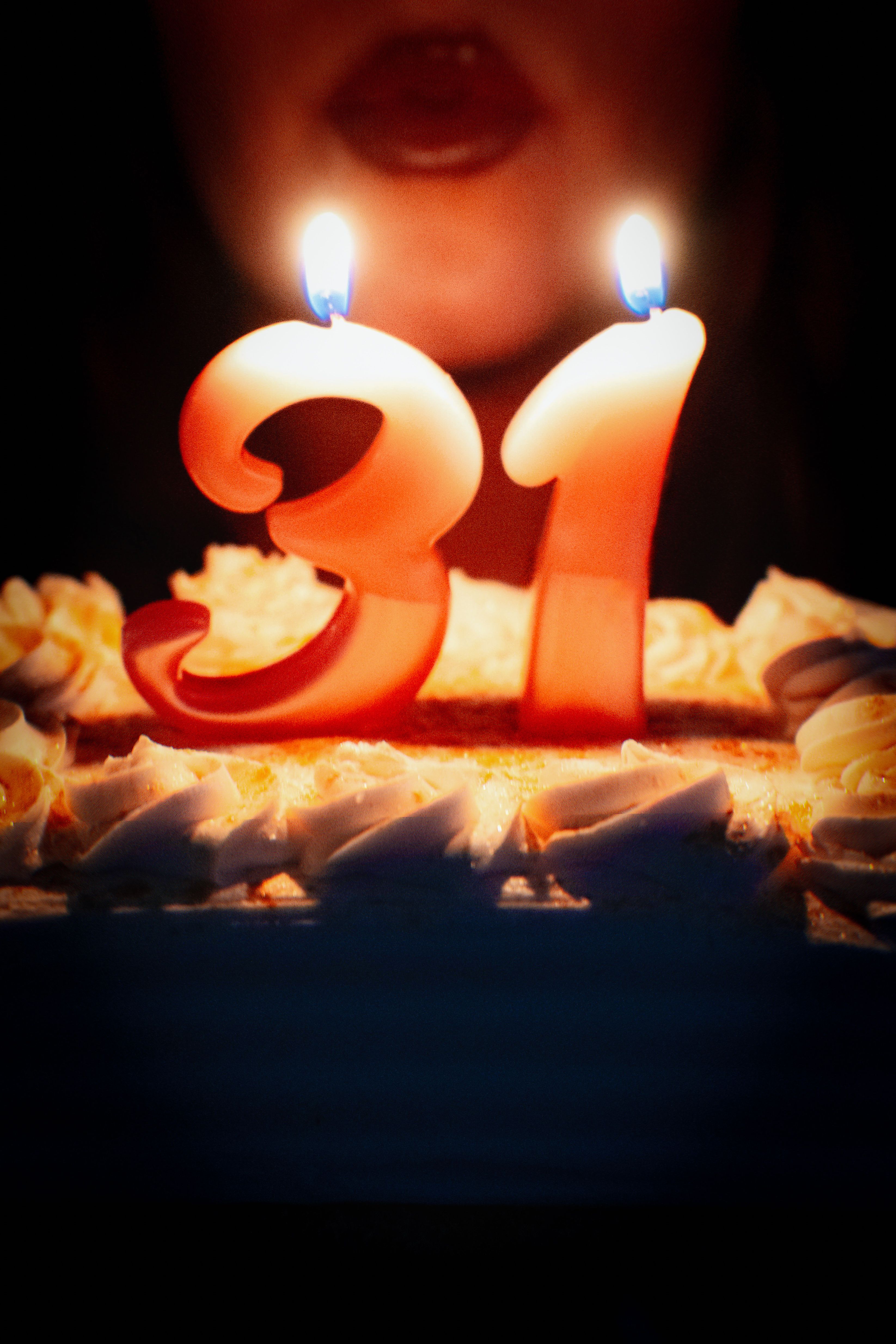 Candlelit Birthday Cake with 31 Numerals · Free Stock Photo