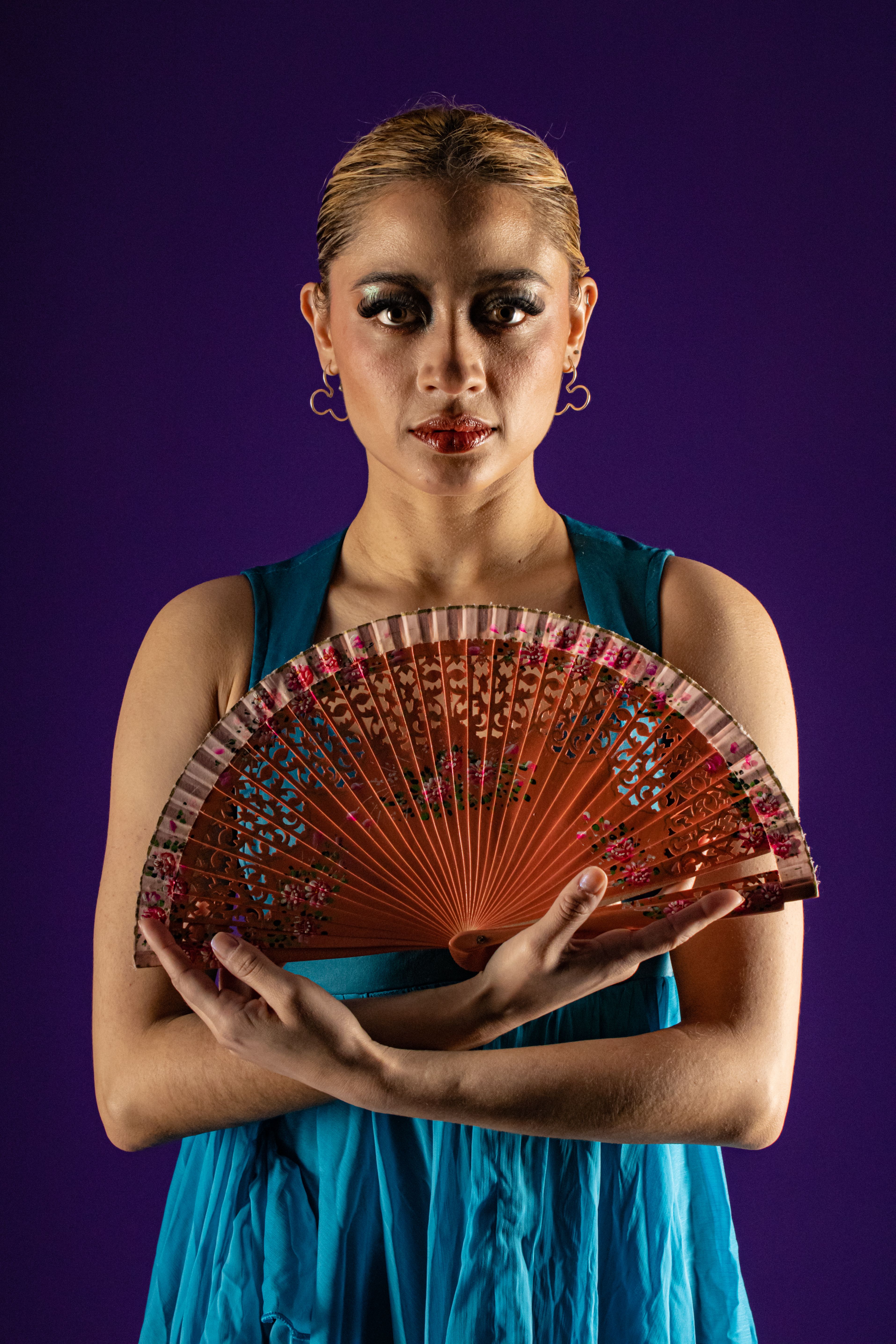 Elegant Flamenco Dancer with Decorative Fan · Free Stock Photo