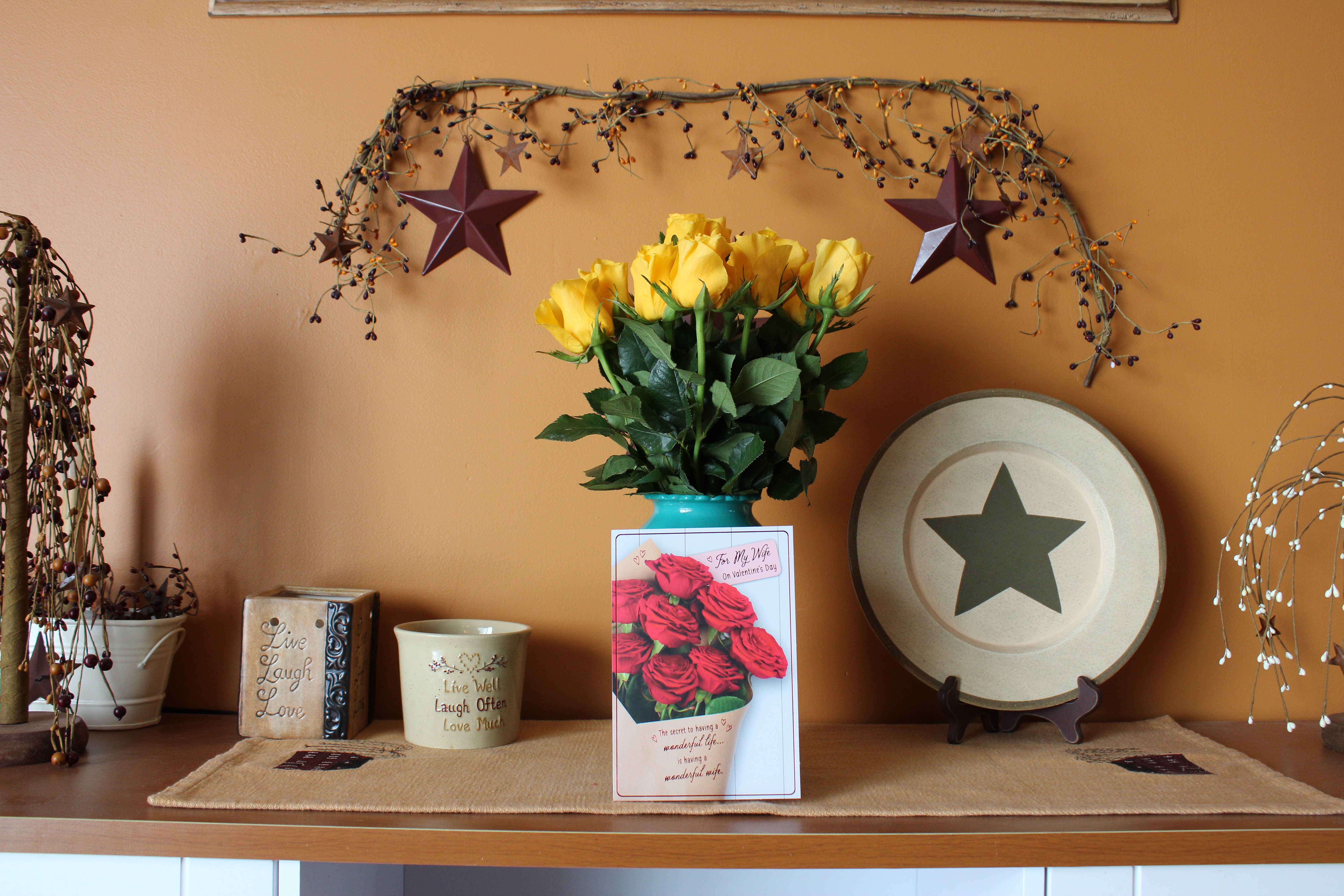 Elegant Yellow Roses in Rustic Indoor Setting · Free Stock Photo