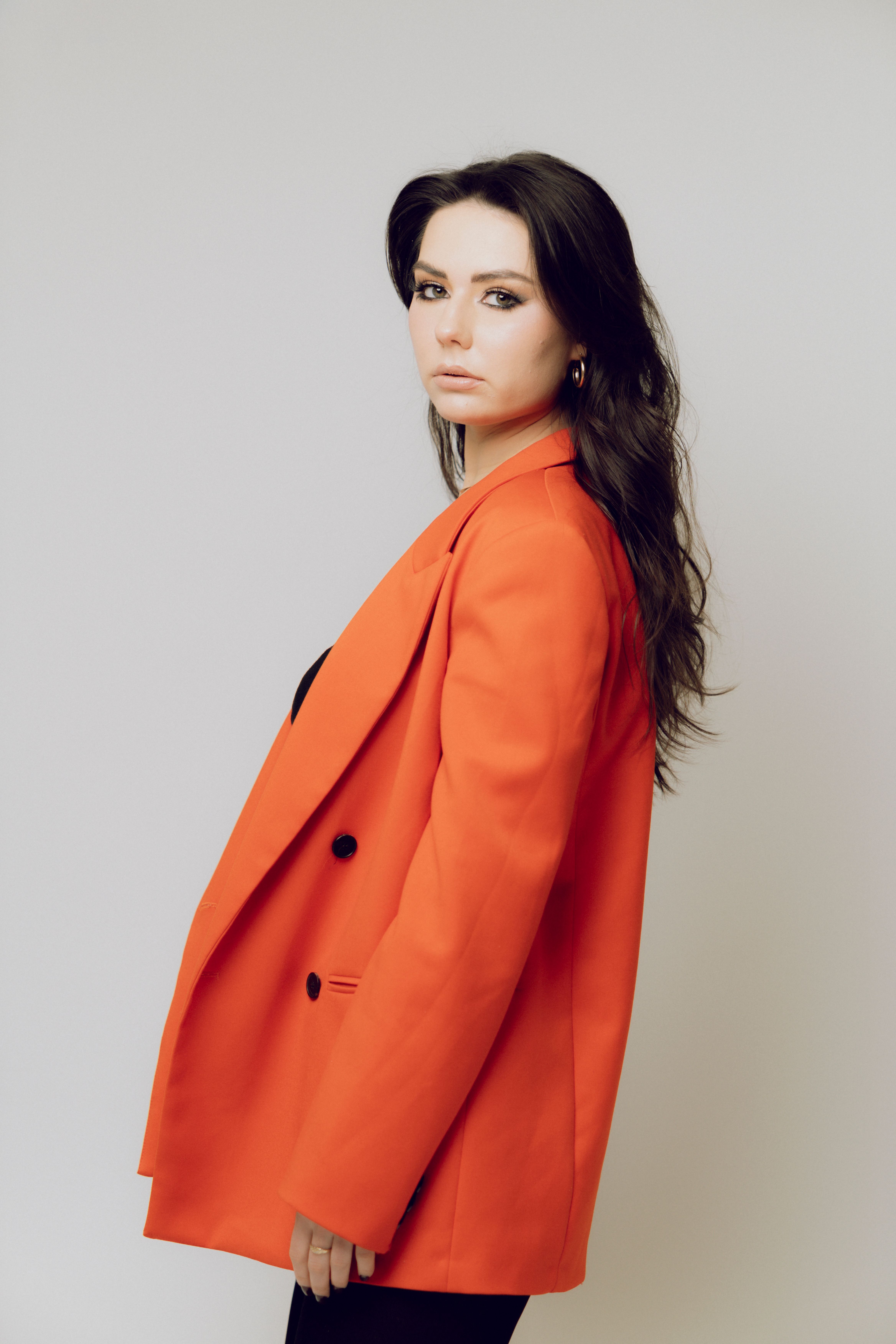 Portrait of Woman in Vibrant Red Jacket · Free Stock Photo