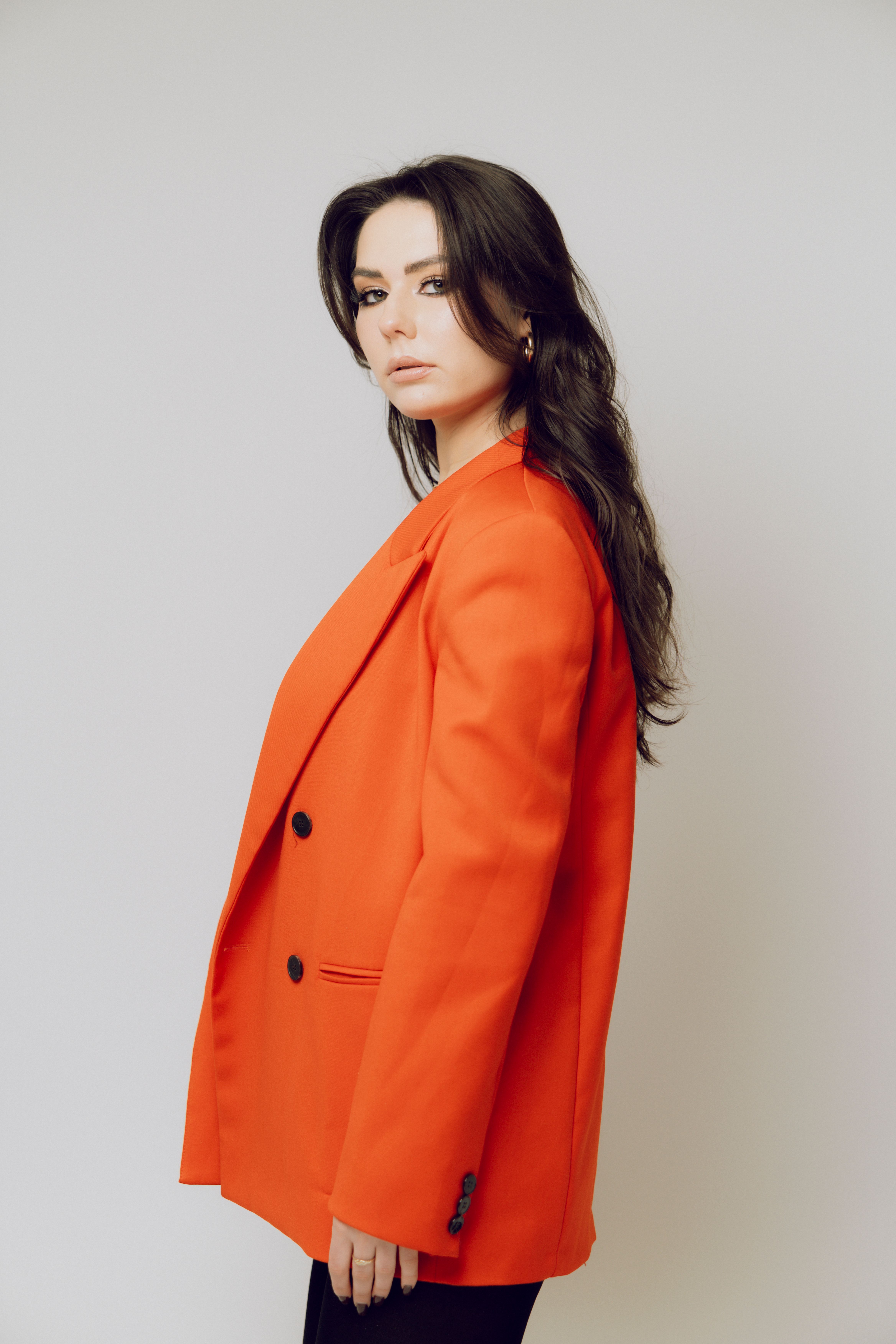 Confident Woman in Bright Red Jacket Portrait · Free Stock Photo