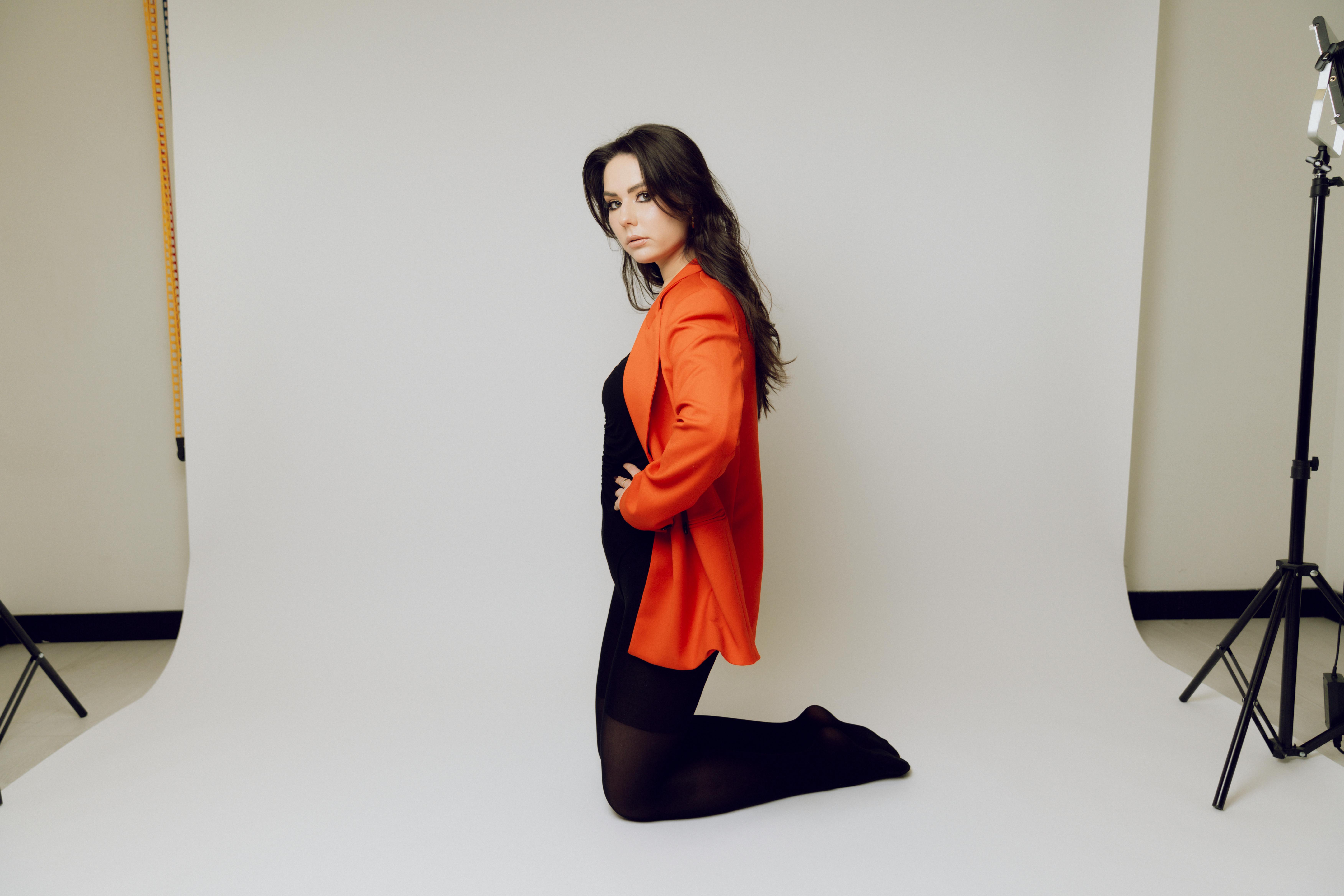 Elegant Portrait with Red Jacket in Studio · Free Stock Photo