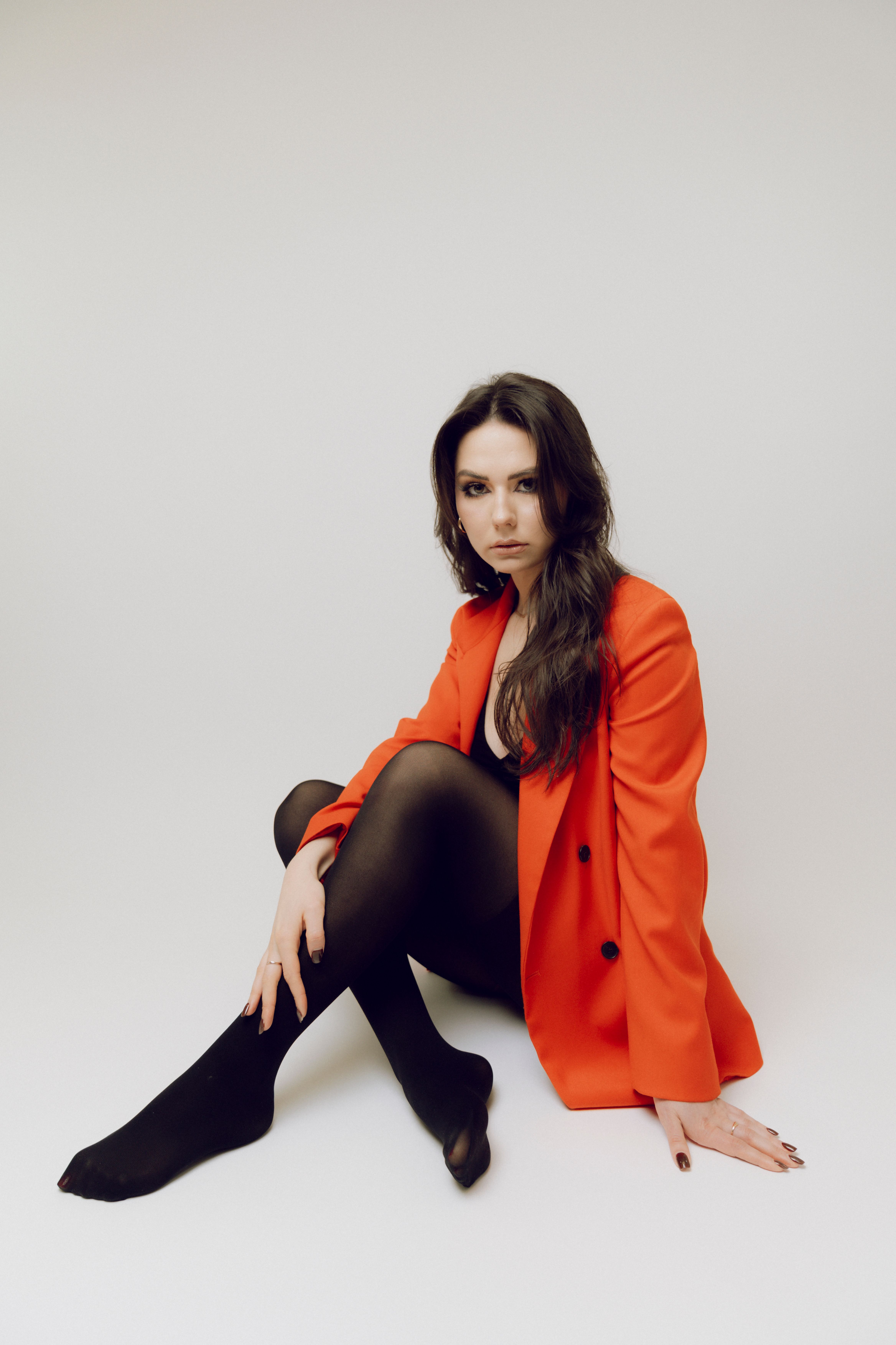 Stylish Portrait of Woman in Bold Red Jacket · Free Stock Photo