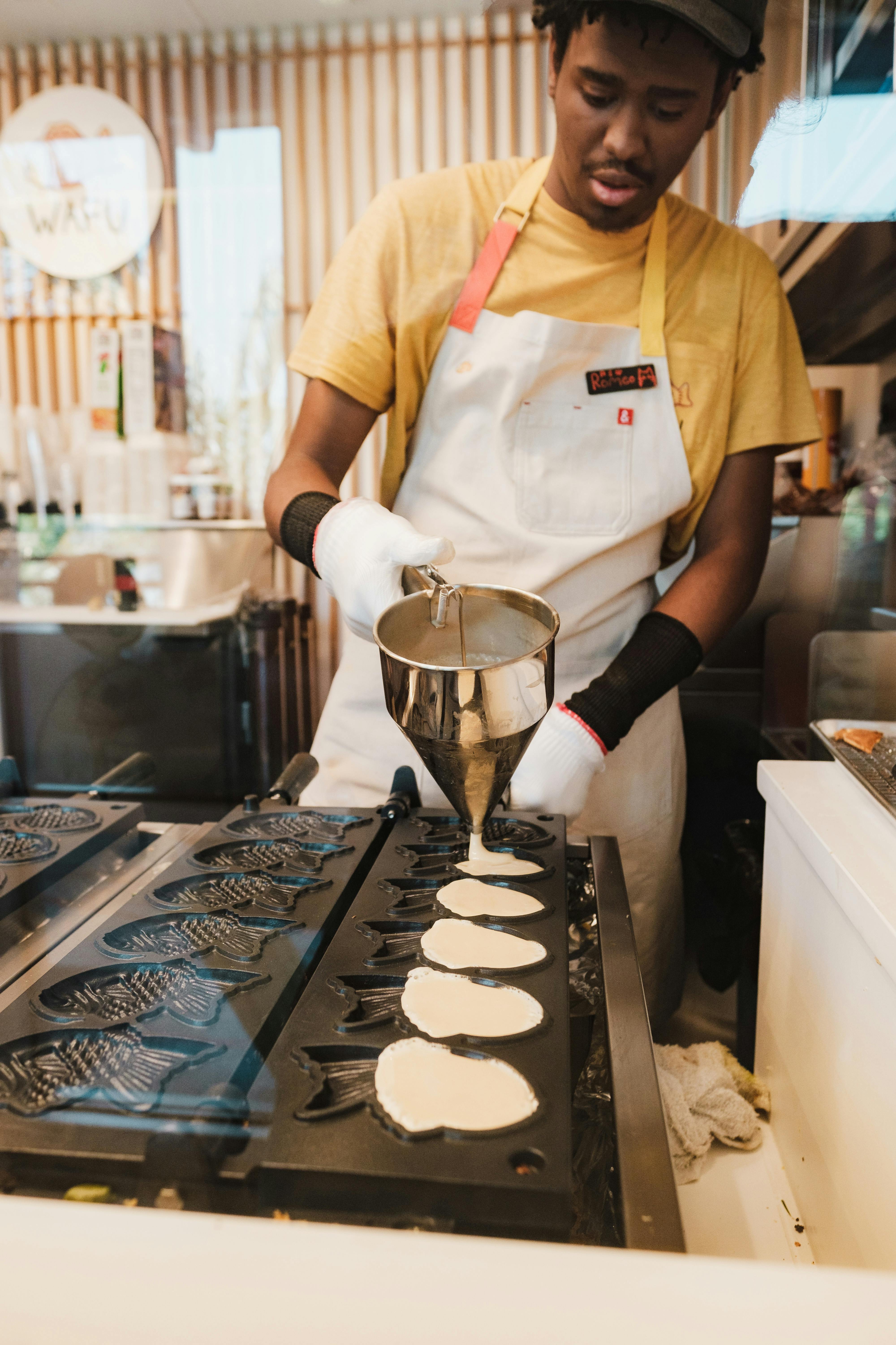 Making Traditional Taiyaki at Street Food Stall · Free Stock Photo