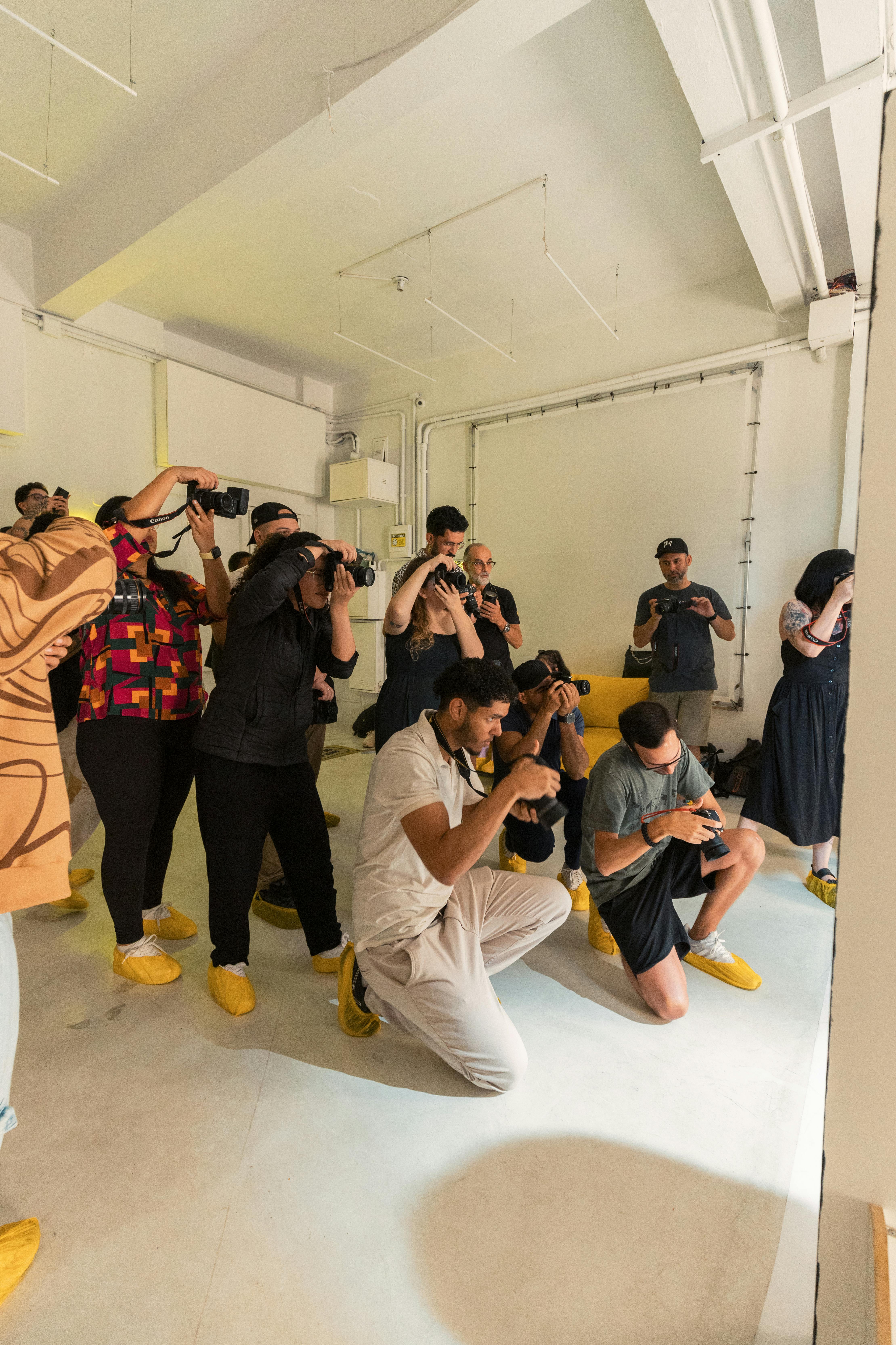 Group of Photographers in Studio Setting · Free Stock Photo