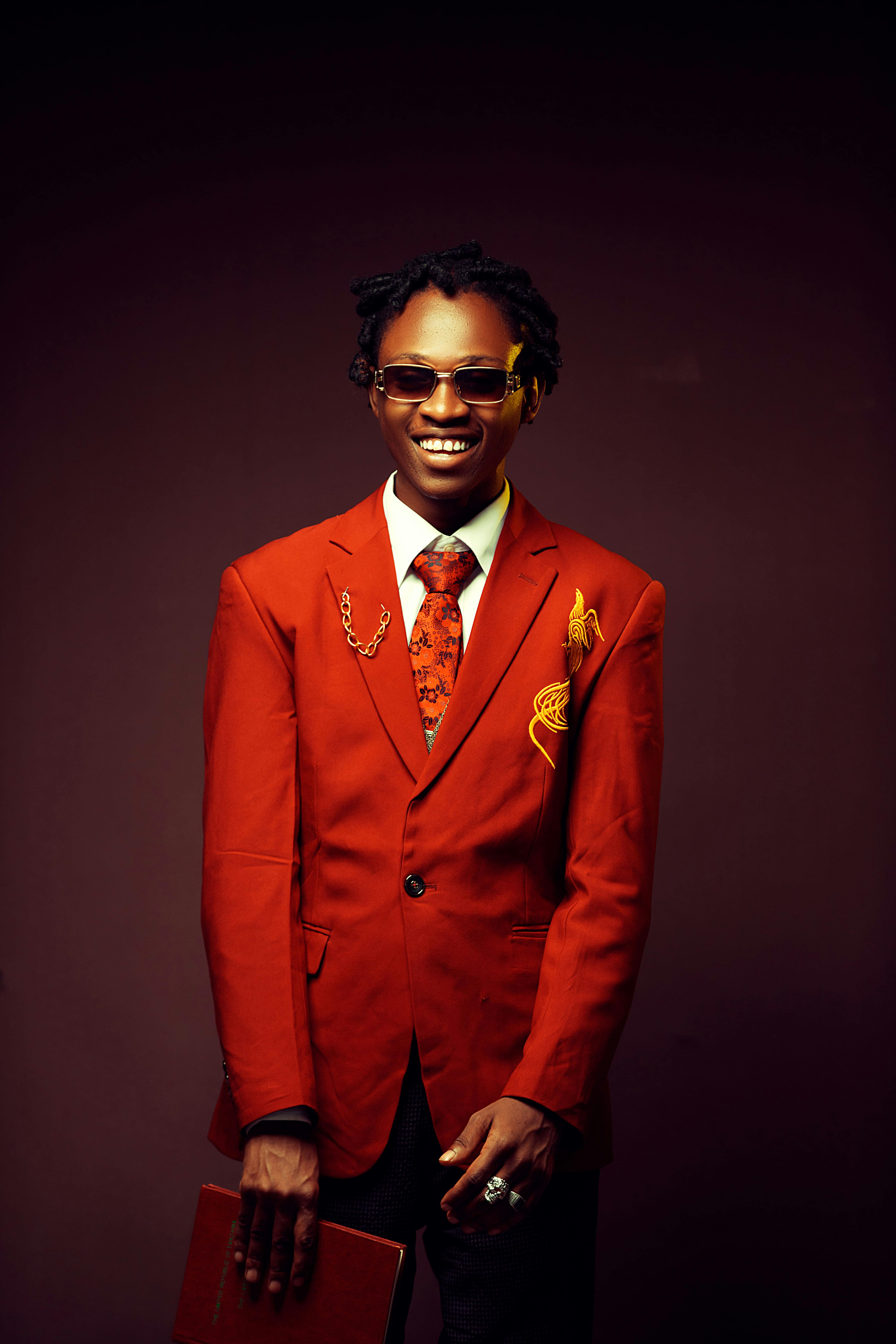 Stylish Man in Bright Red Suit Smiling · Free Stock Photo