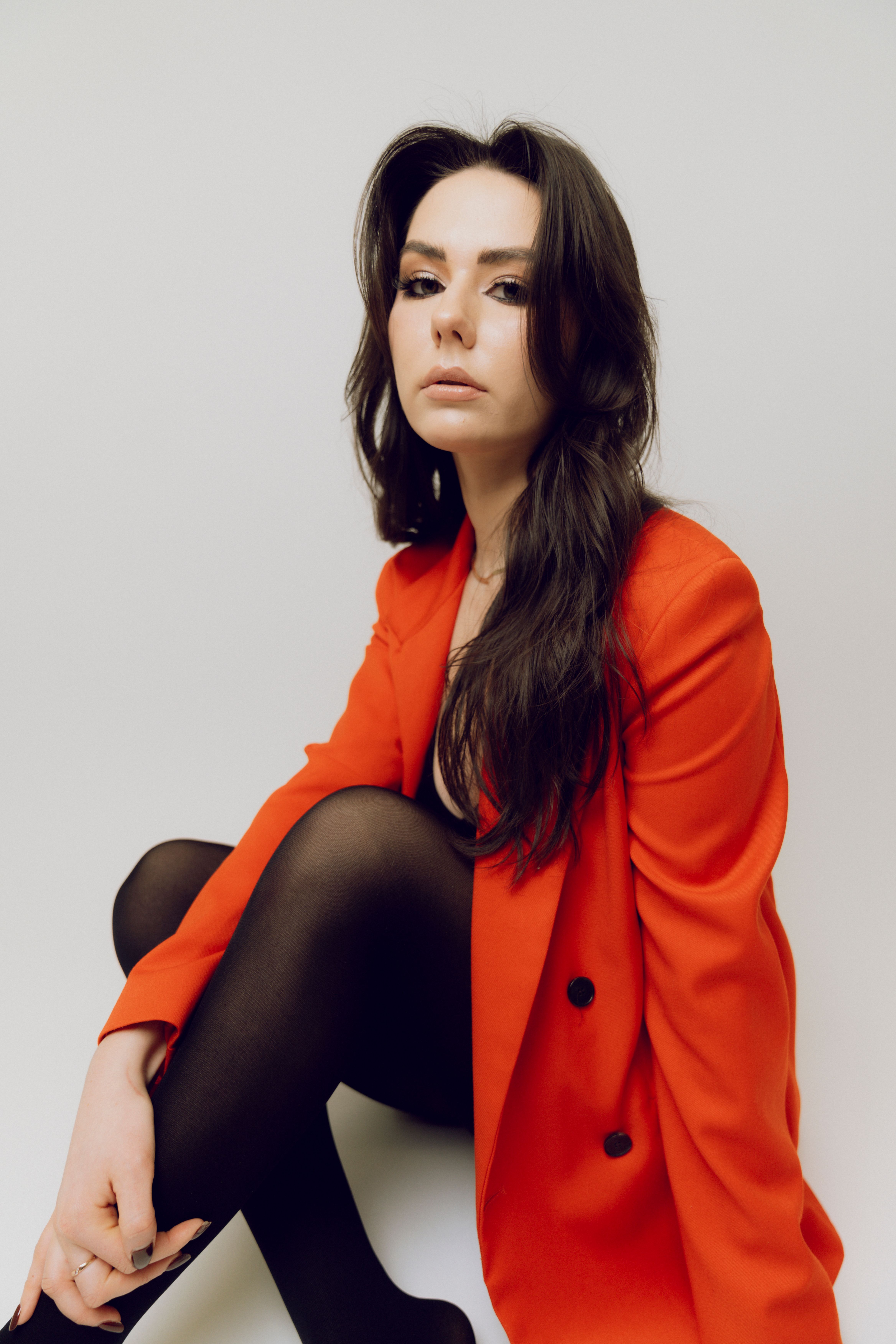 Sophisticated Portrait of a Woman in Red Jacket · Free Stock Photo