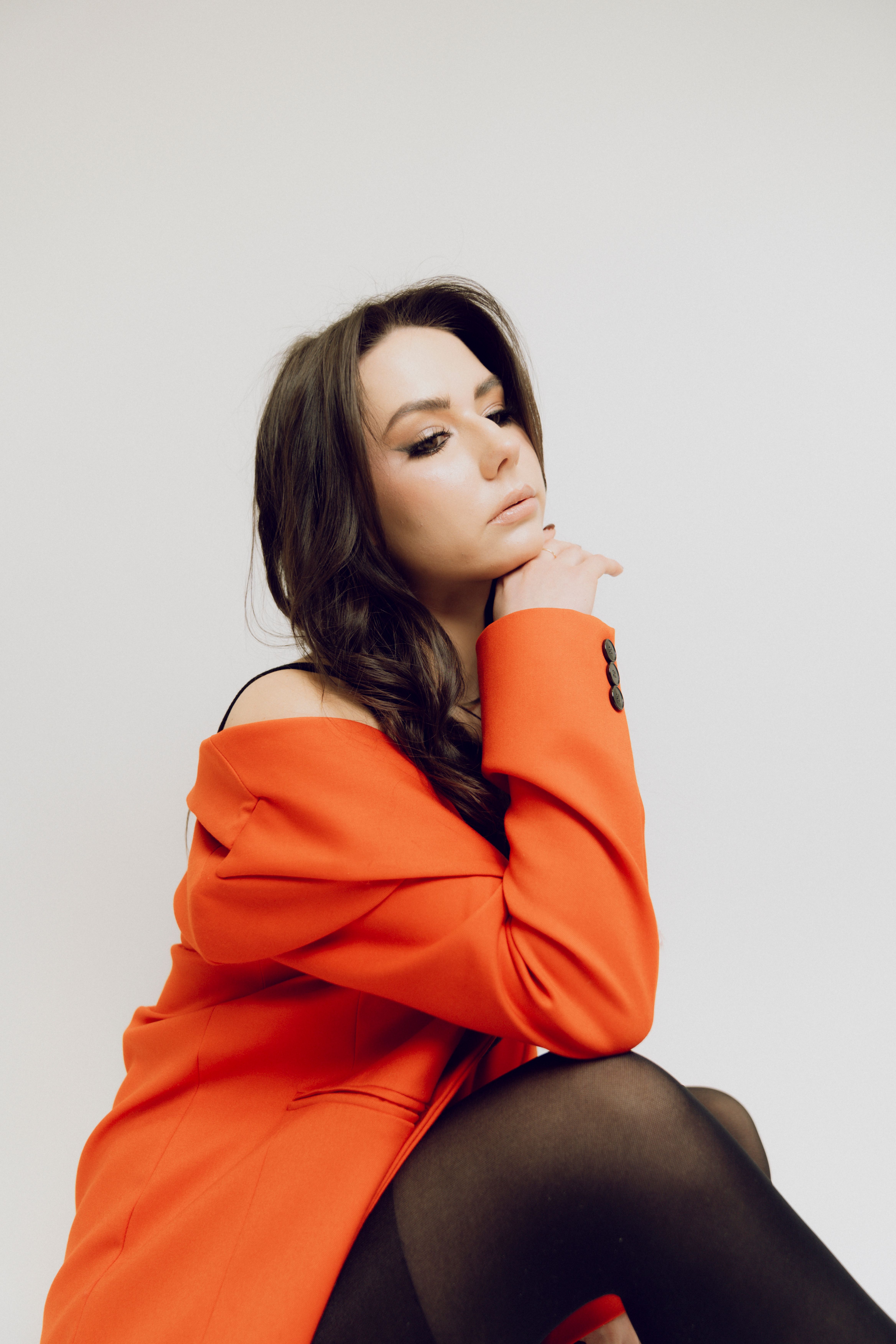 Fashion Portrait in Red Jacket on White Background · Free Stock Photo