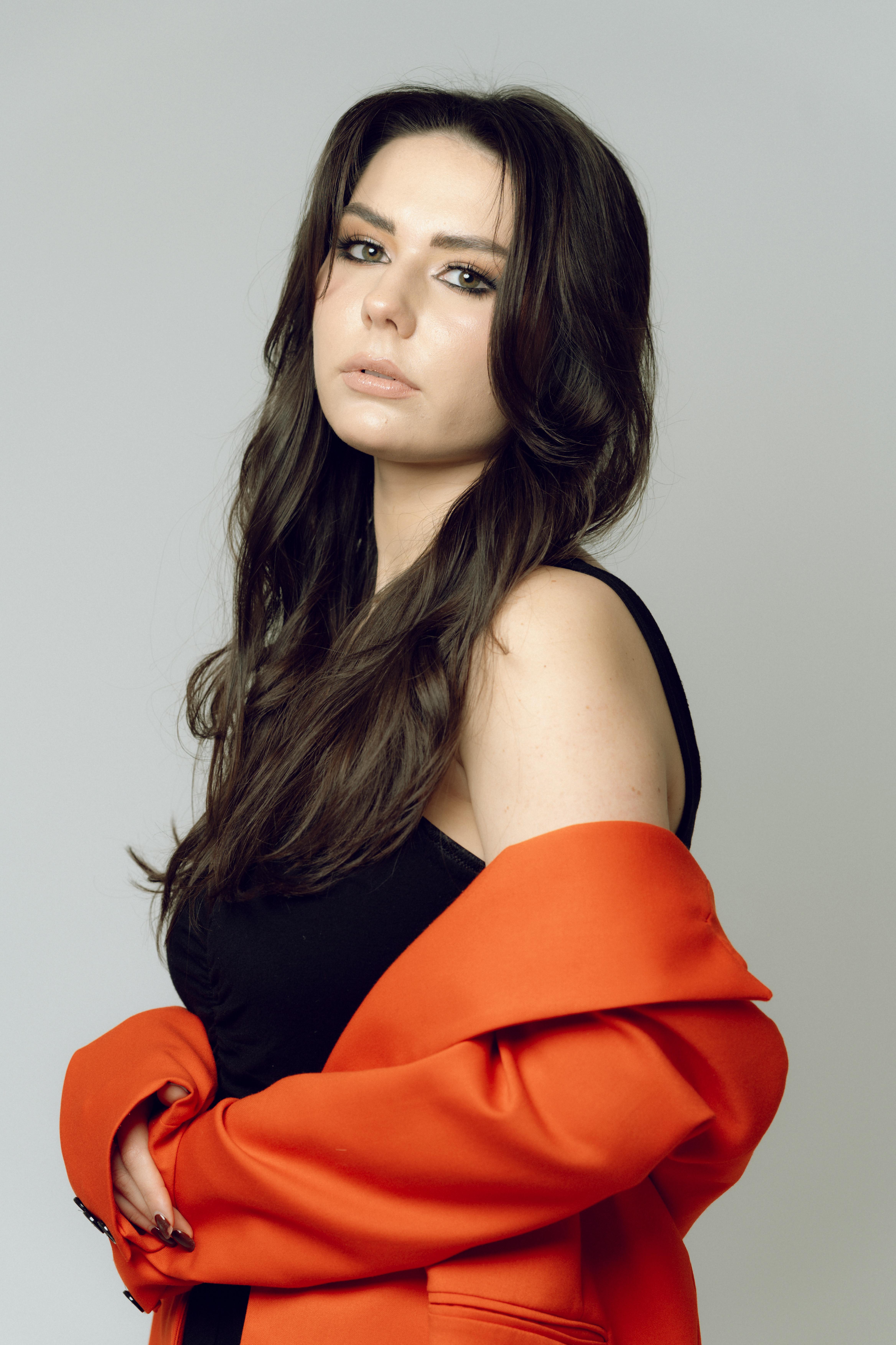 Elegant Fashion Model in Red Jacket Portrait · Free Stock Photo