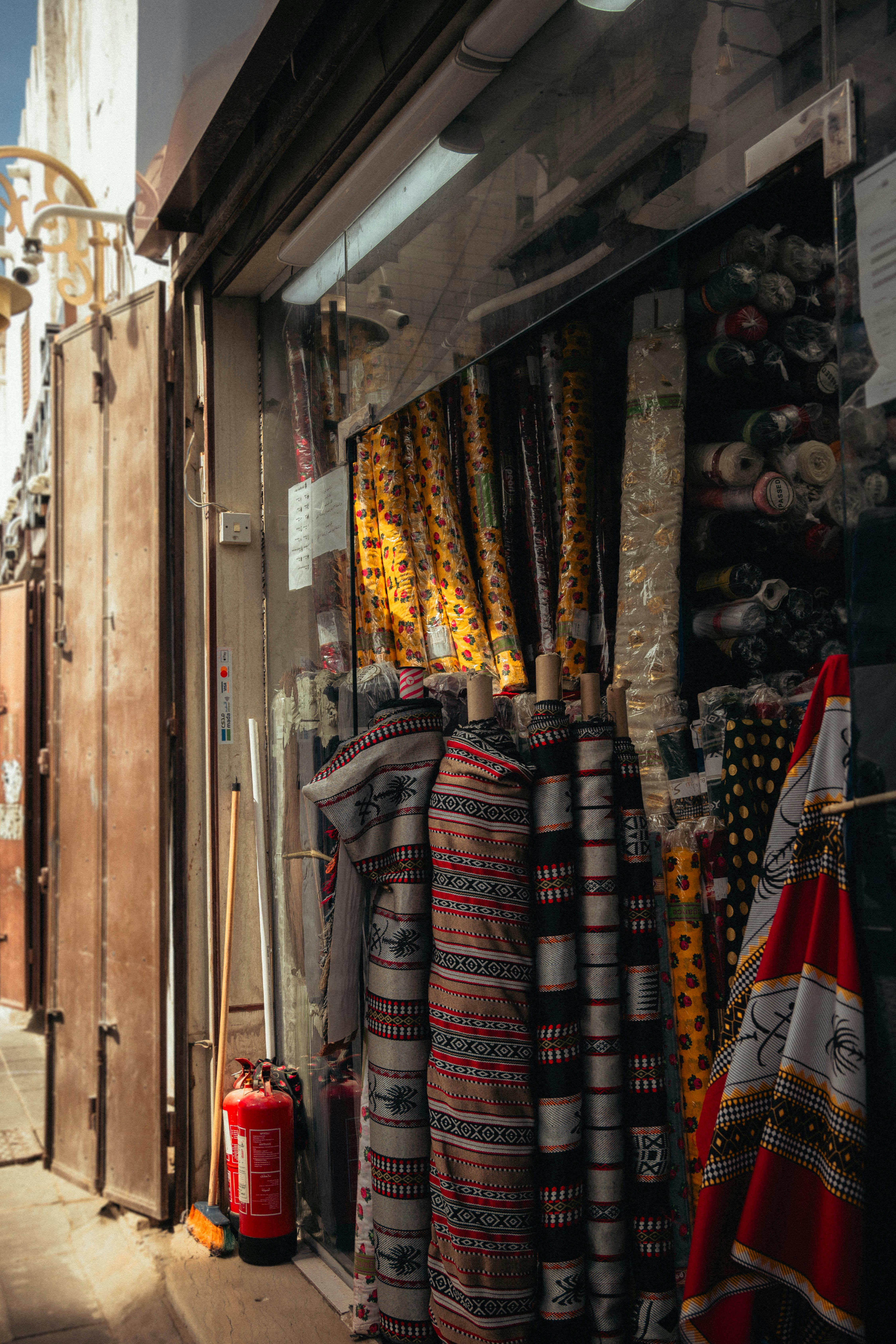 Colorful Fabrics on Display at a Market Stall · Free Stock Photo