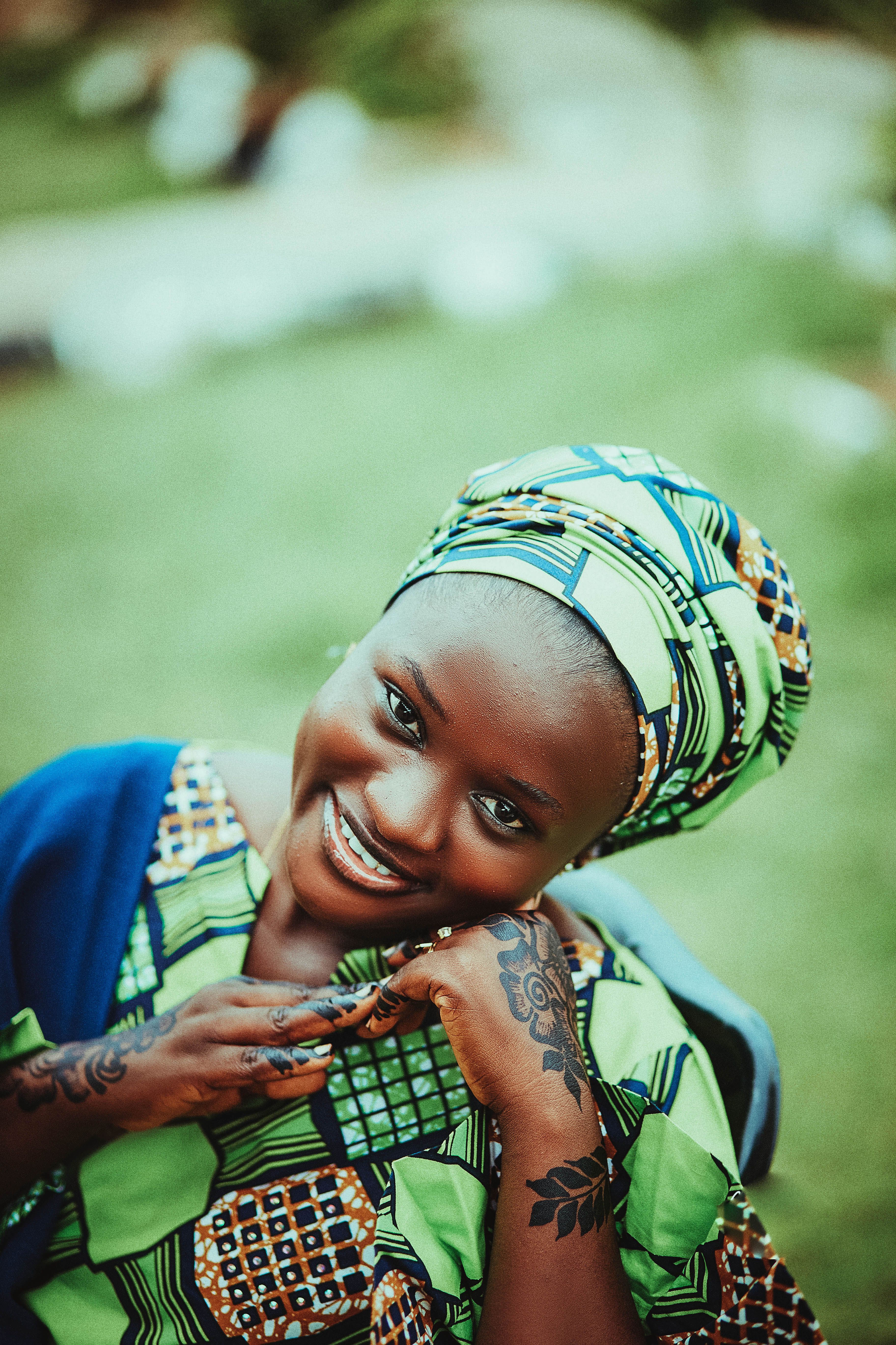 Smiling African Woman in Traditional Attire Outdoors · Free Stock Photo