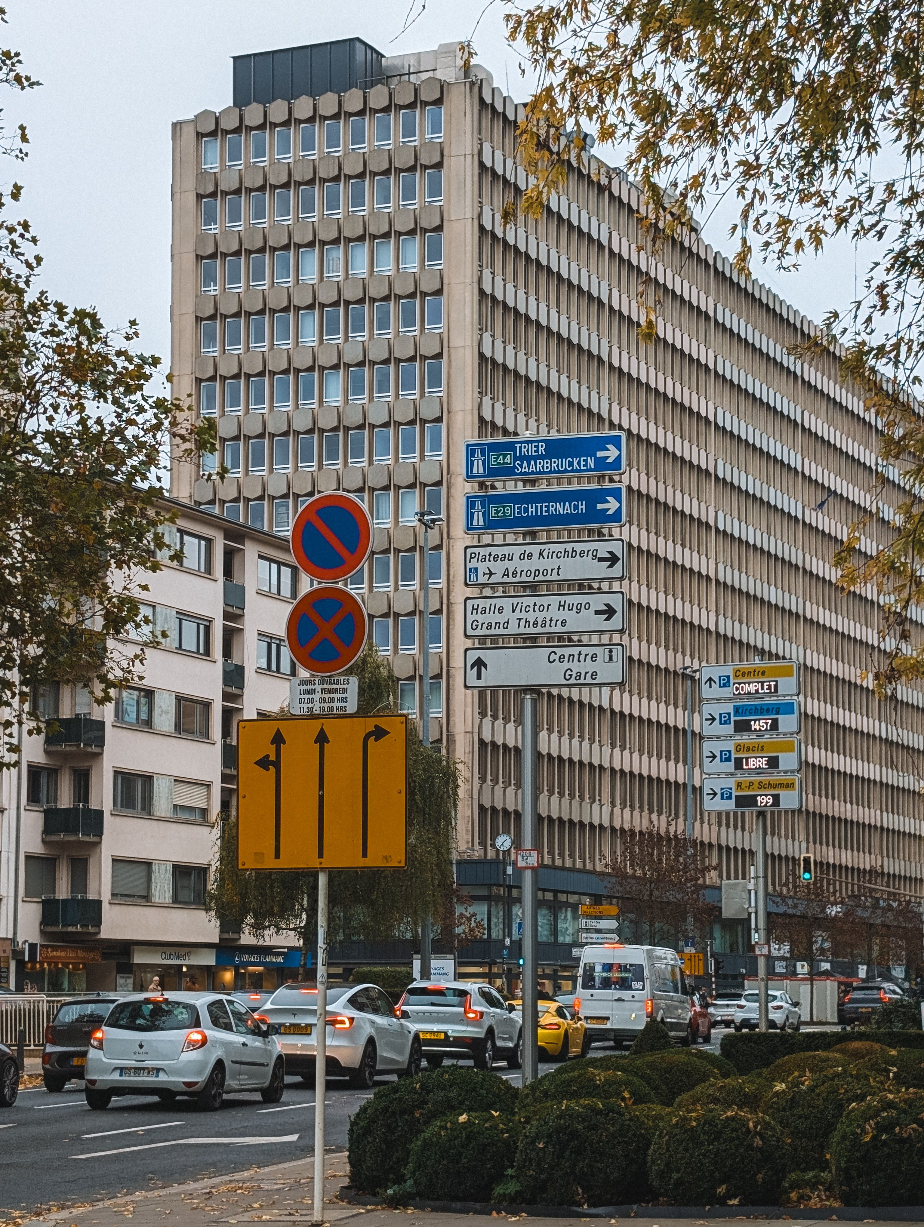 Urban Traffic Scene with Directional Signs · Free Stock Photo