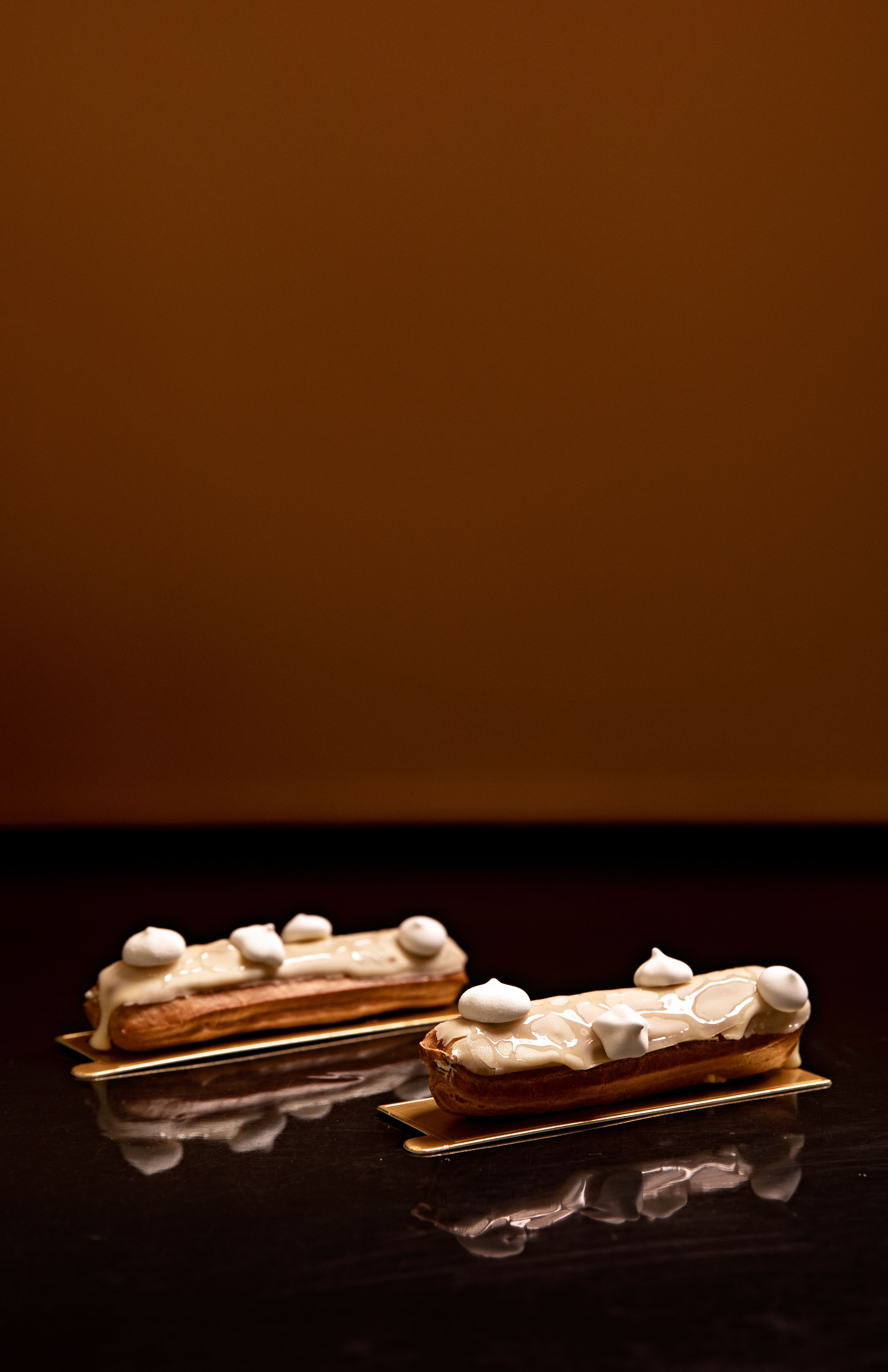 Delicious Eclairs with Whipped Cream Topping · Free Stock Photo