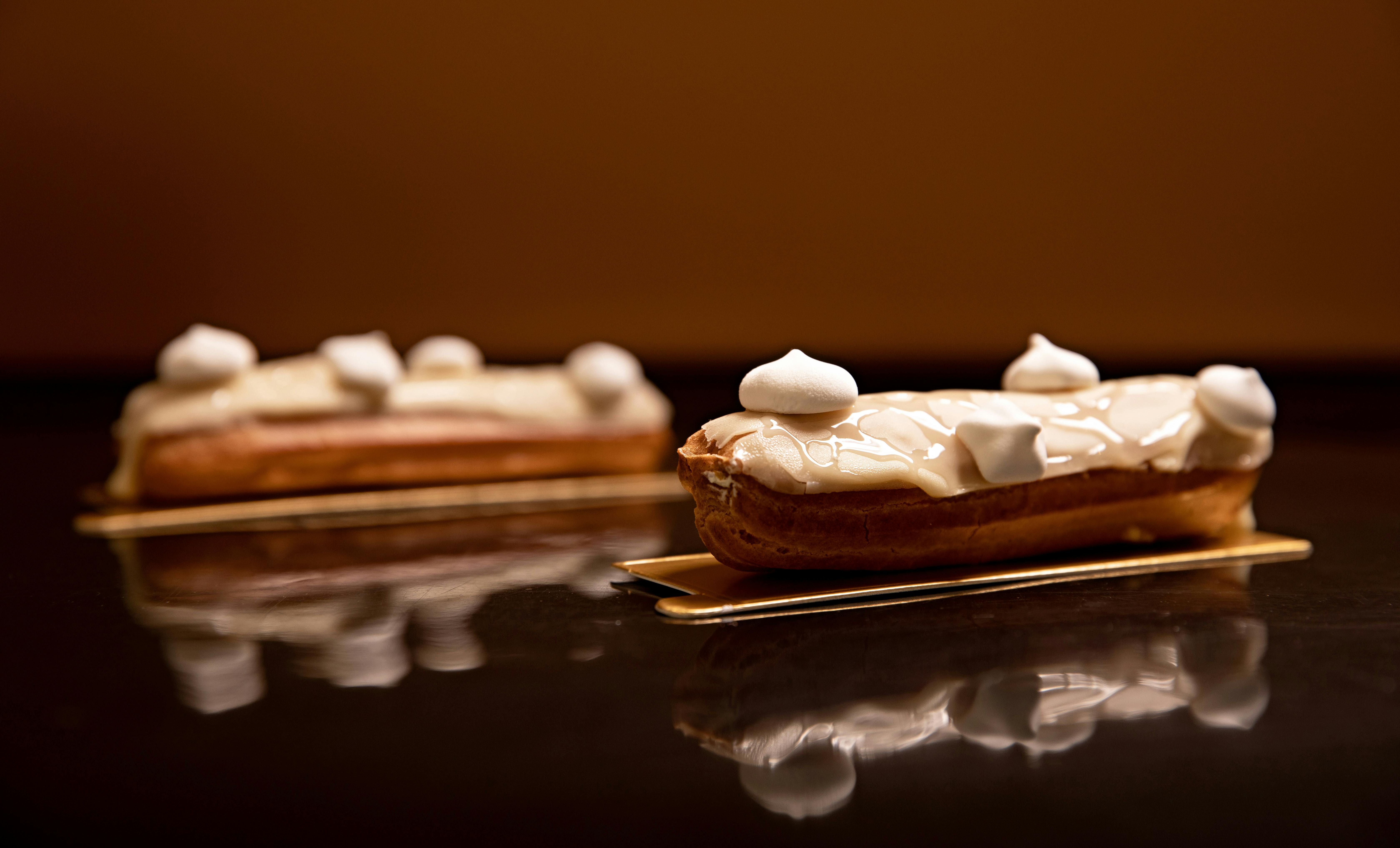 Gourmet Eclairs on Elegant Display · Free Stock Photo
