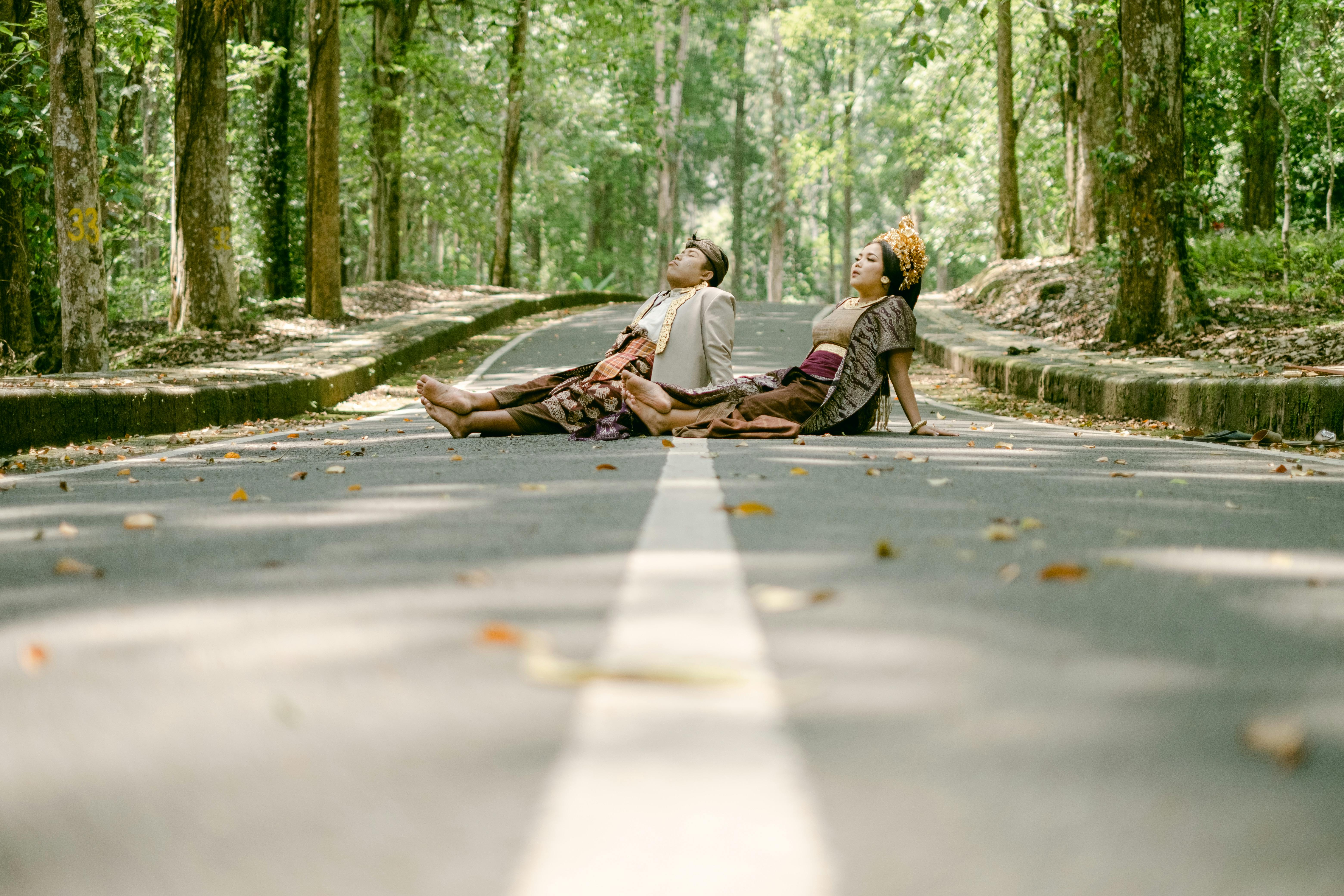 Traditional Dancers Resting on Forest Road · Free Stock Photo