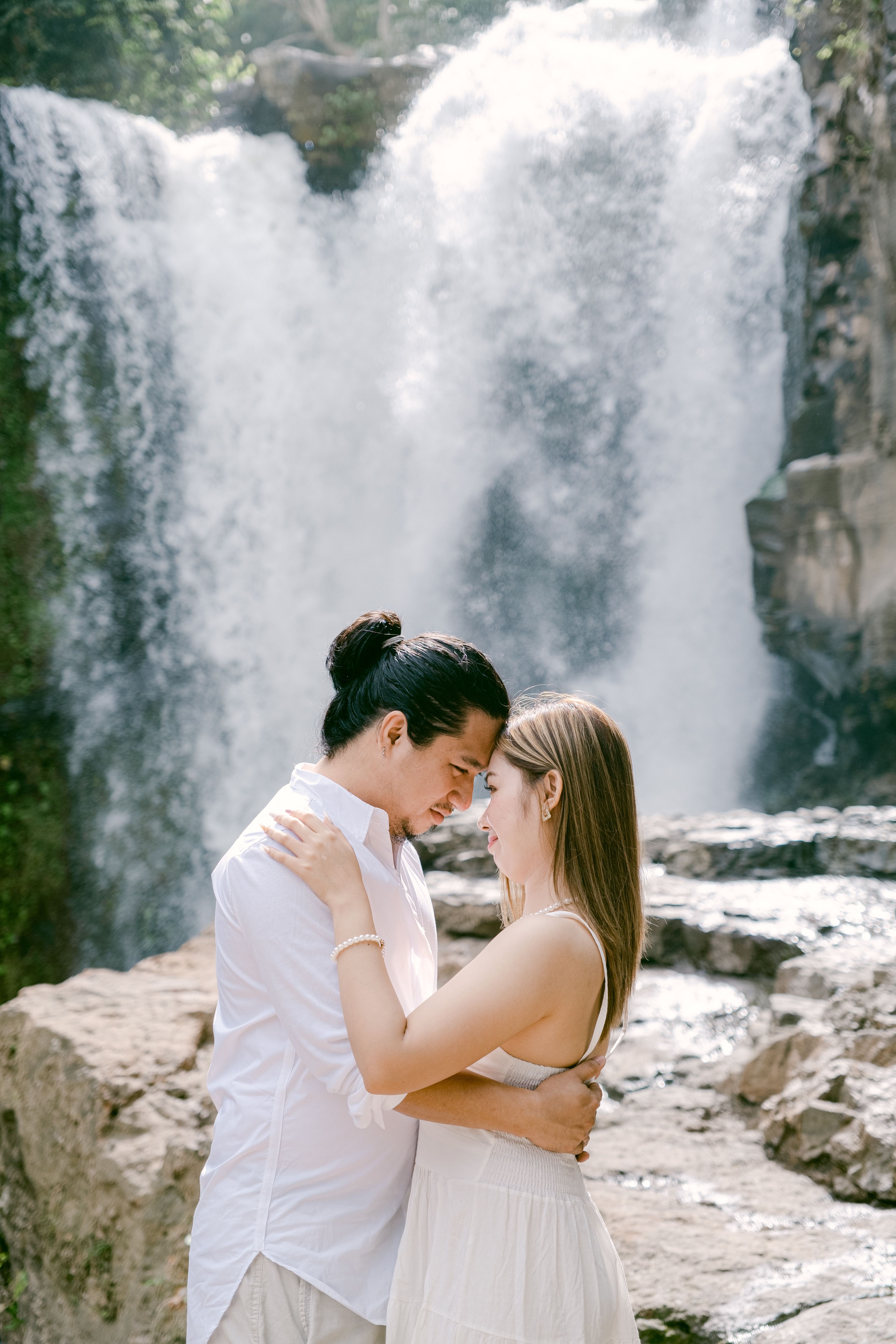 Romantic Couple Embracing by Waterfall · Free Stock Photo