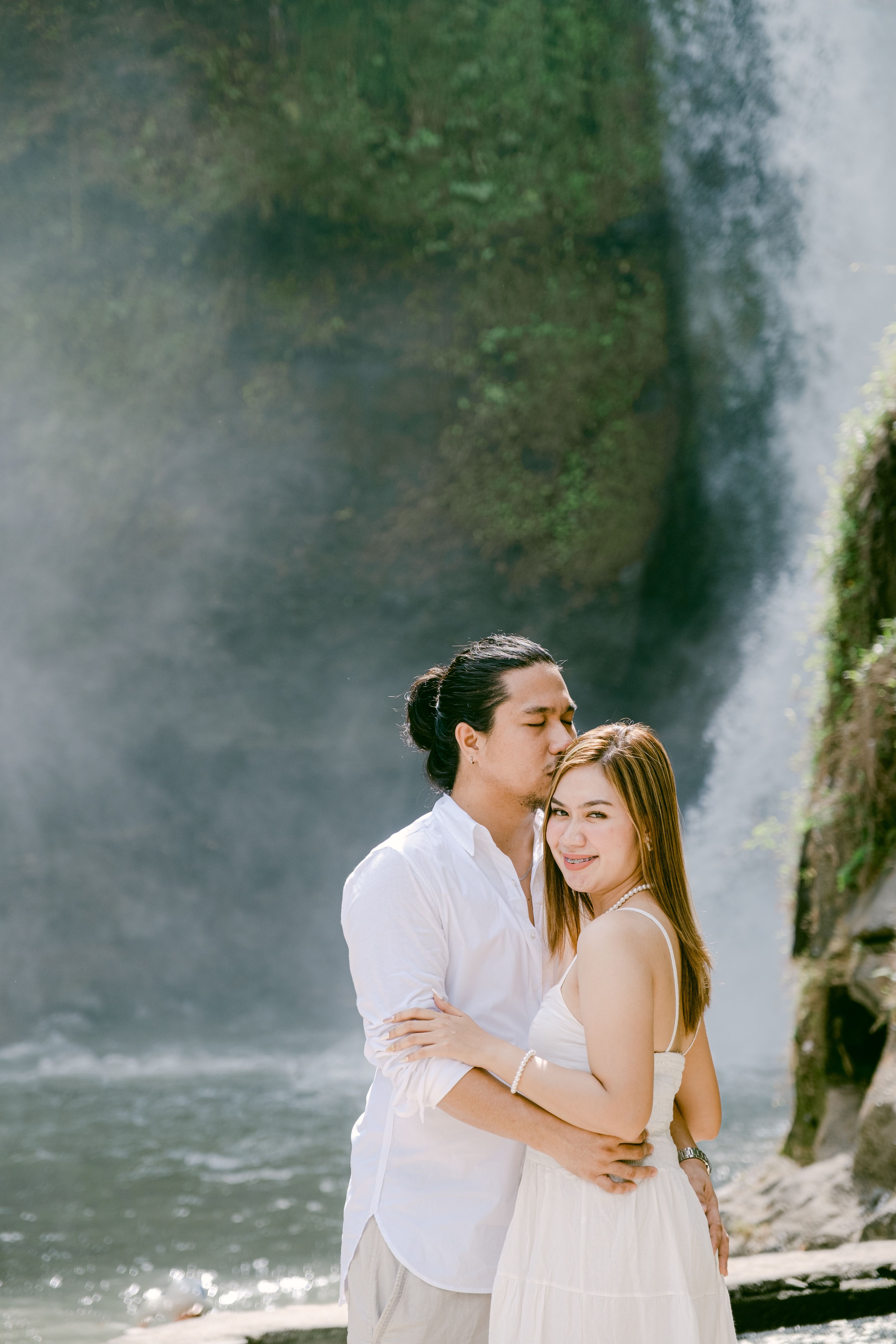 Romantic Couple Embracing by a Waterfall · Free Stock Photo