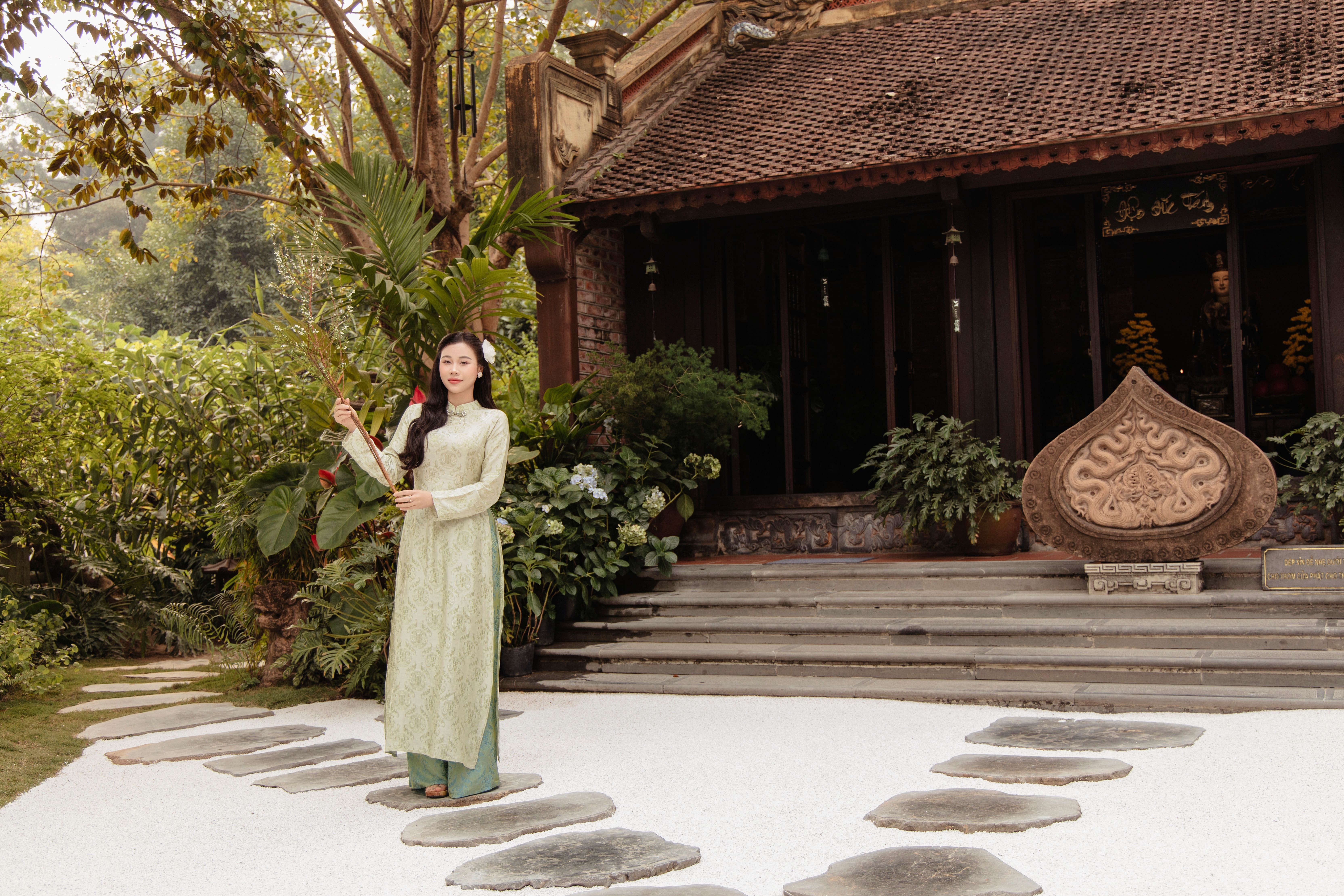 Elegant Woman in Traditional Vietnamese Attire Outdoors · Free Stock Photo