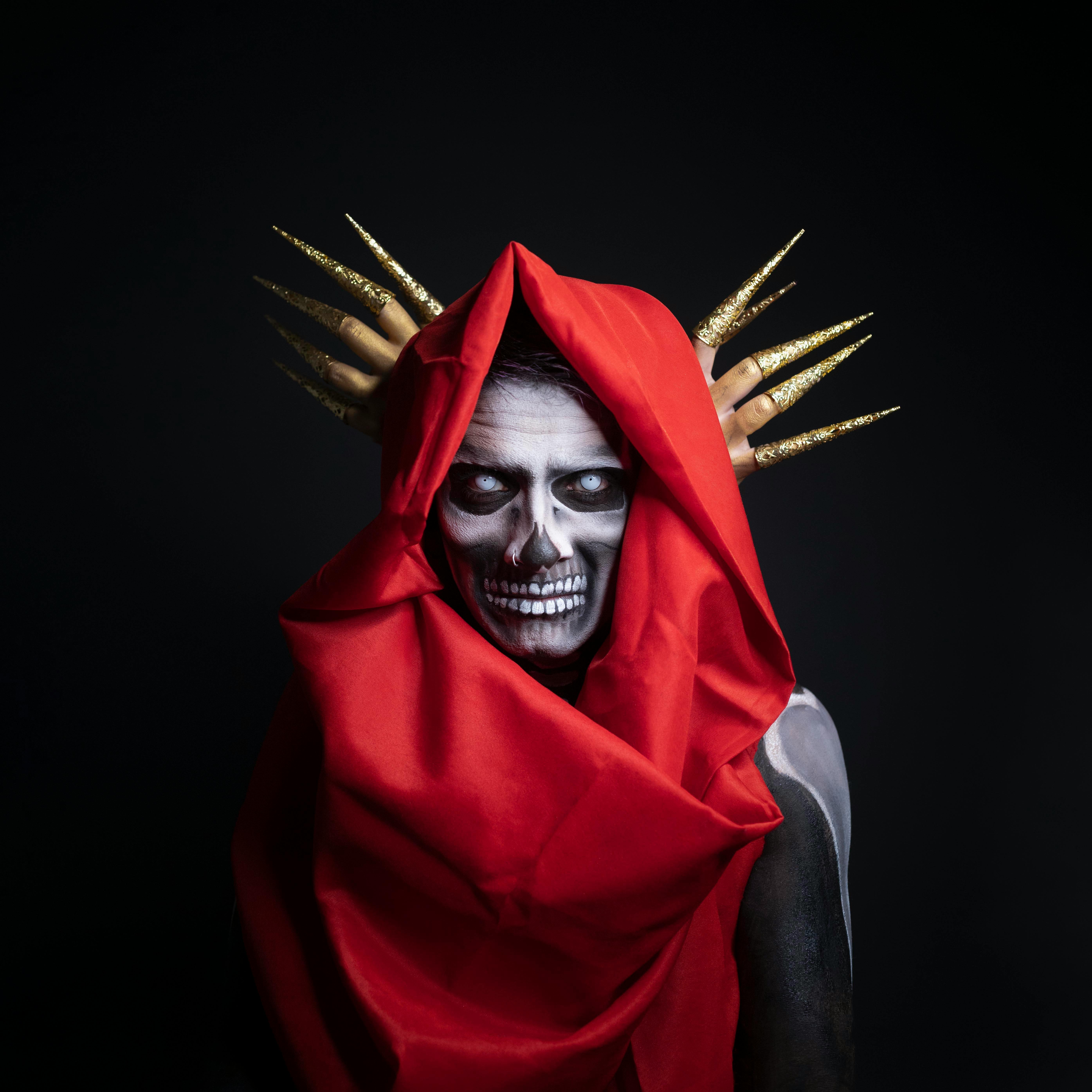 Dramatic Skeleton Makeup in Red Cloak · Free Stock Photo