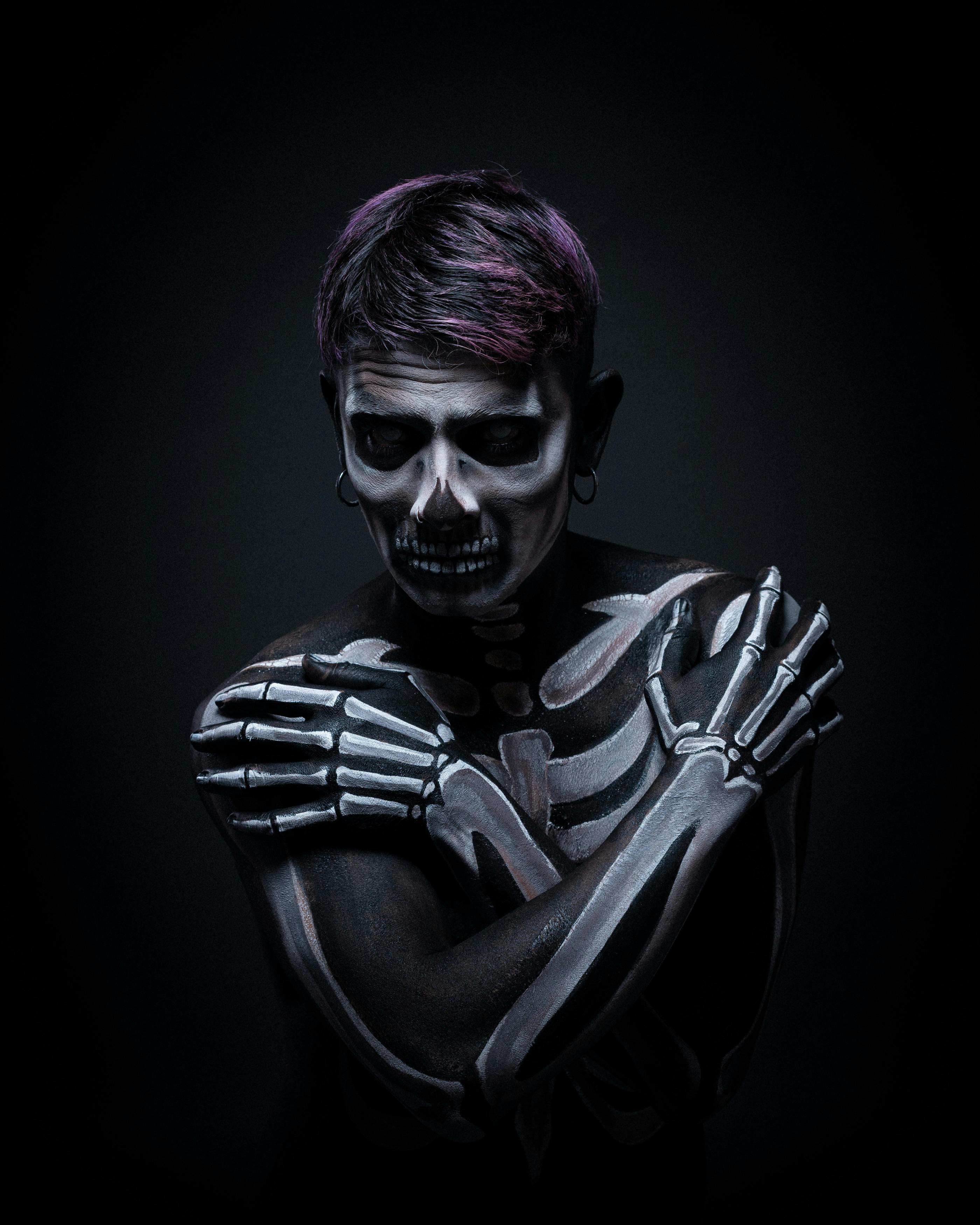 Dramatic Skeleton Makeup Portrait in Dark Setting · Free Stock Photo