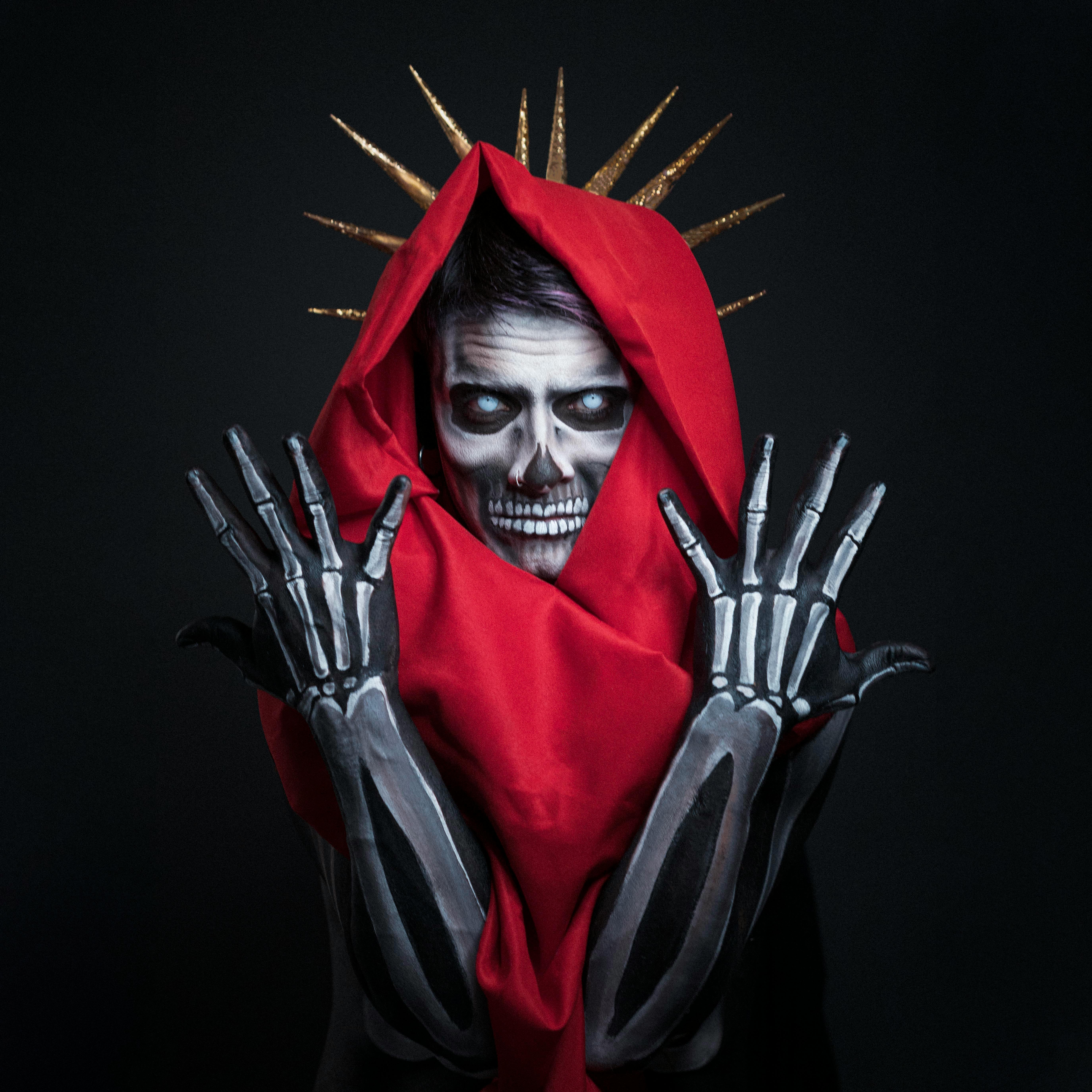 Dramatic Skeleton Makeup with Red Cloak · Free Stock Photo