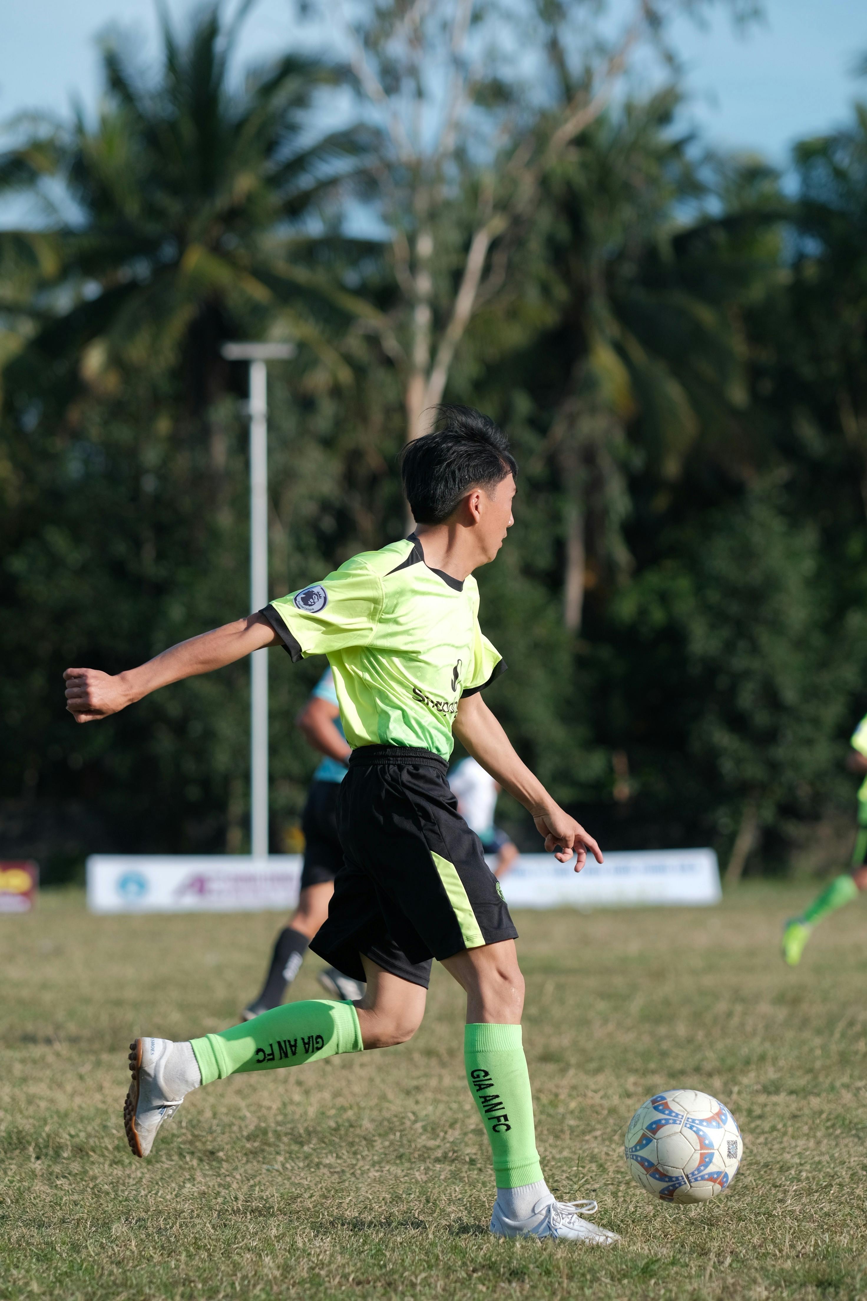 Action shot of youth soccer player on field · Free Stock Photo