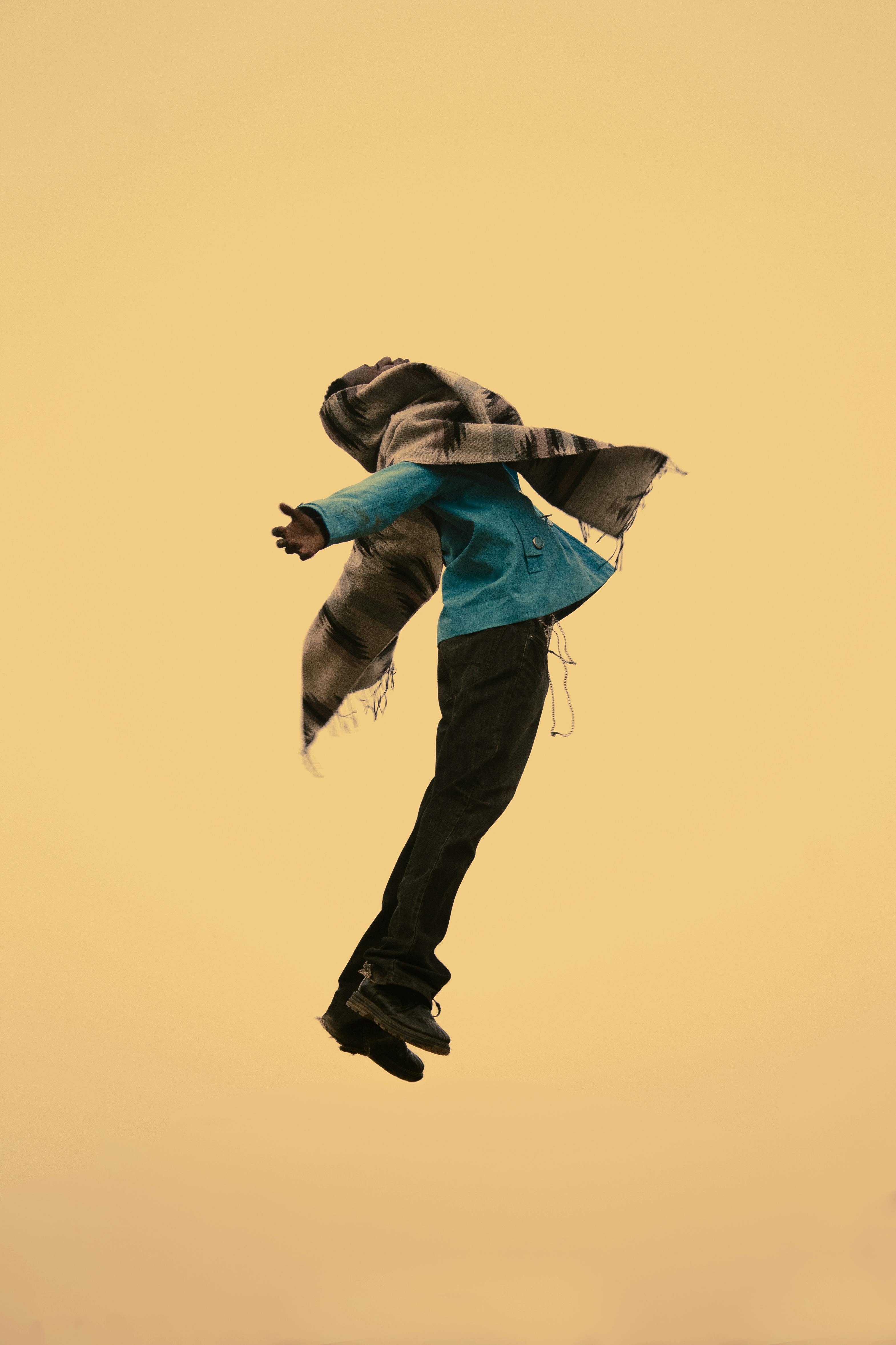 Dynamic Leap Against Golden Sky · Free Stock Photo