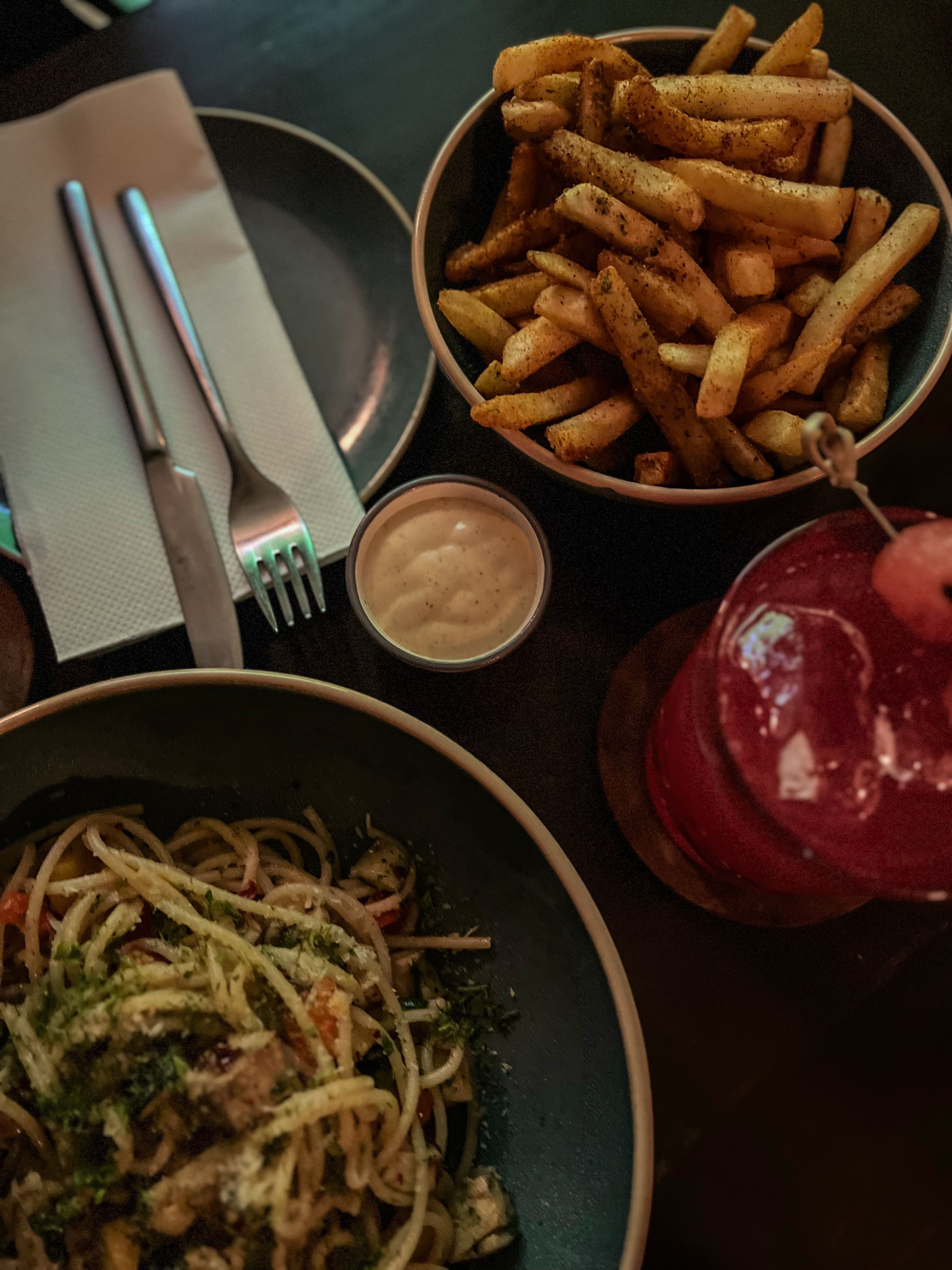 Delicious Italian Pasta with French Fries and Drink · Free Stock Photo