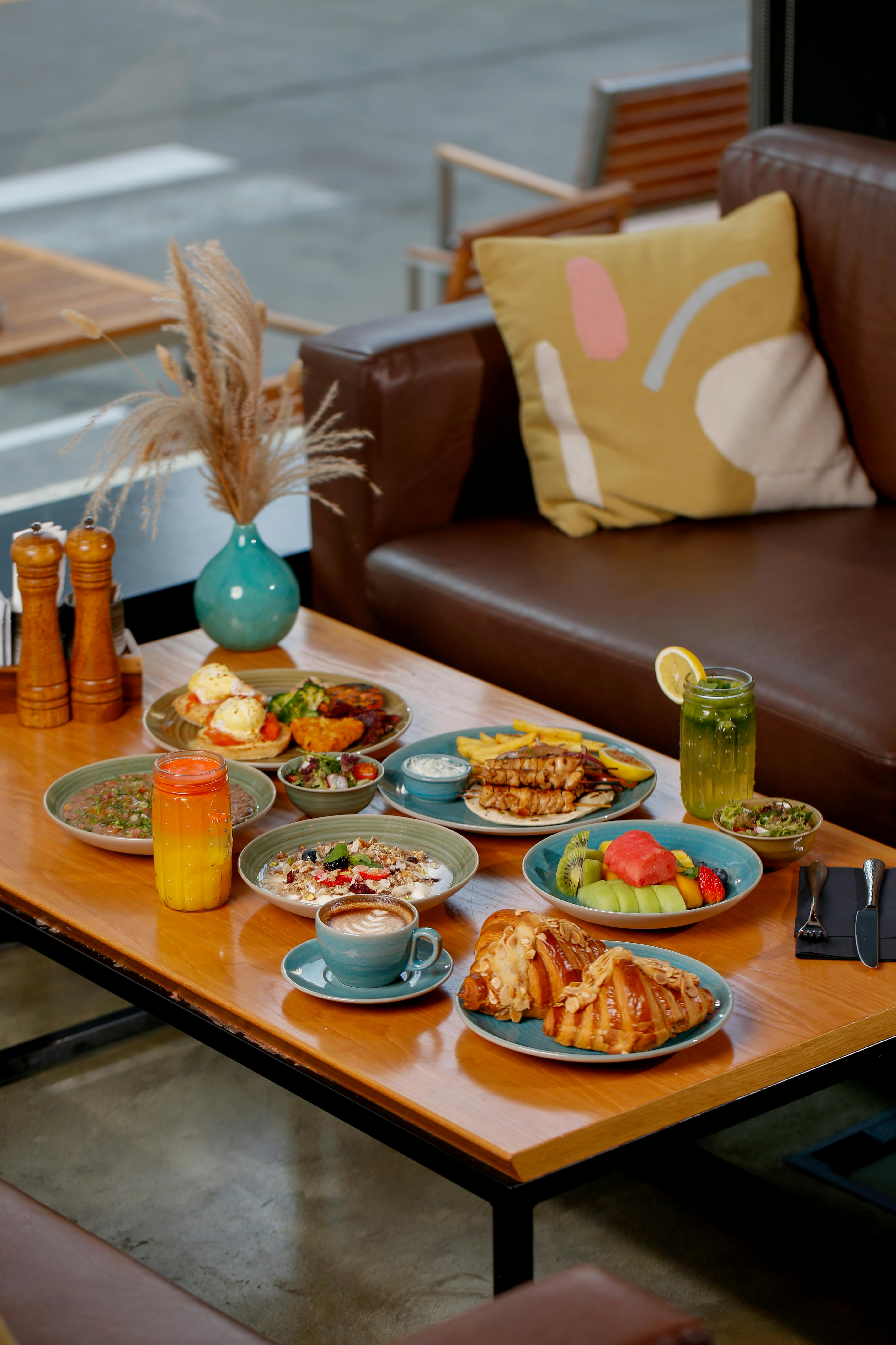Colorful Brunch Spread in Cozy Cafe Setting · Free Stock Photo
