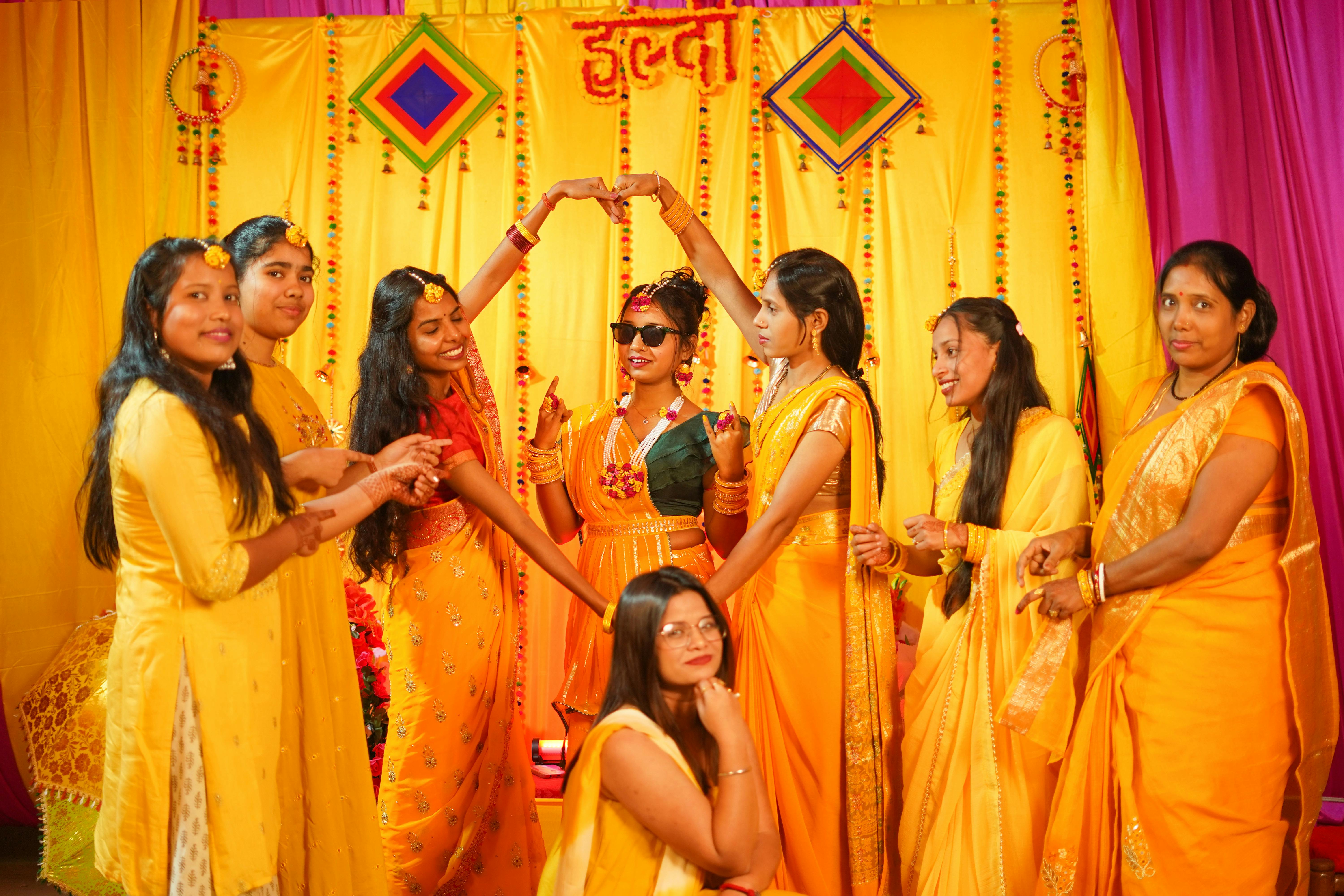 Colorful Indian Haldi Ceremony Group Photo · Free Stock Photo