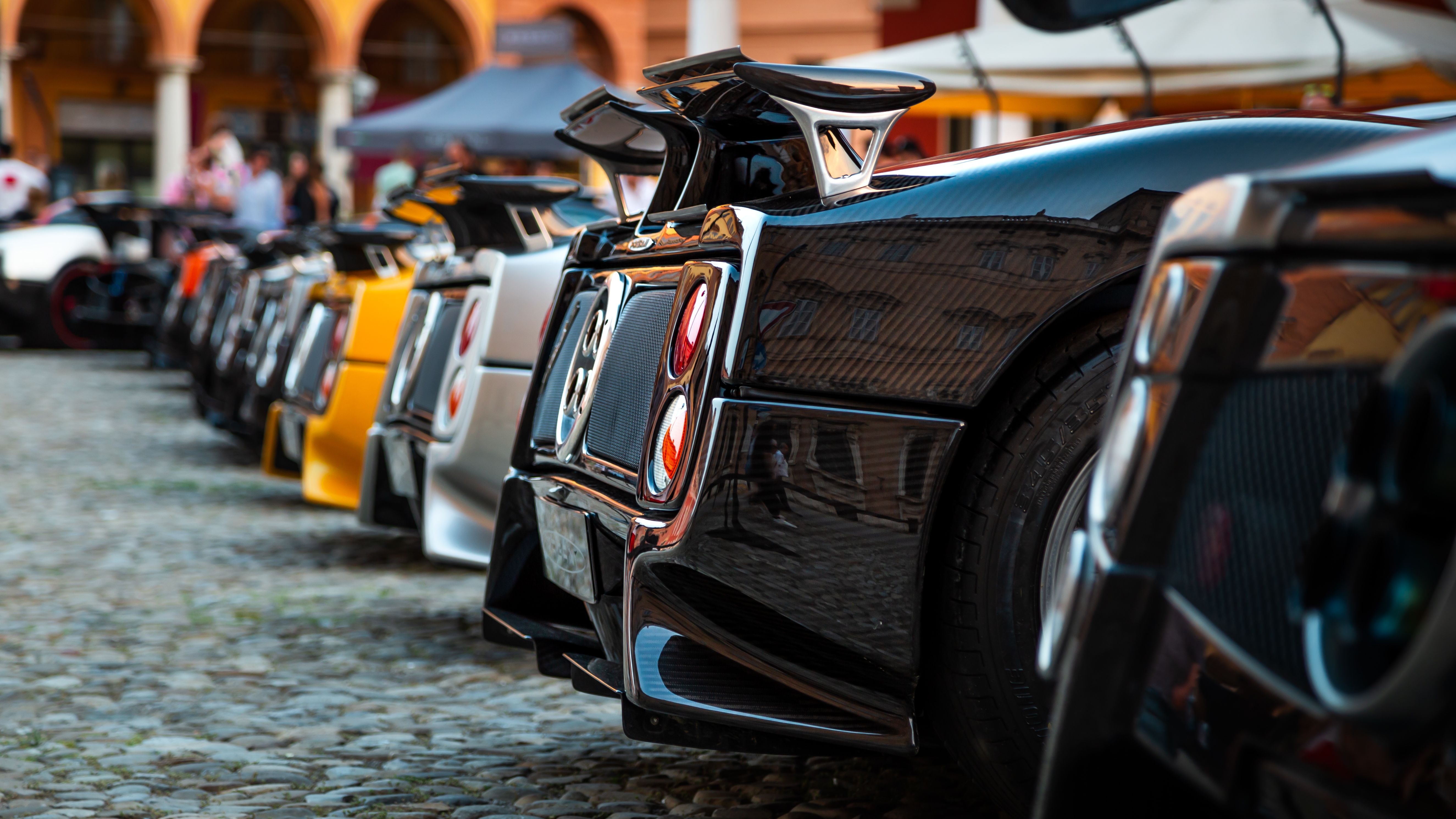 Lineup of Luxurious Supercars at Outdoor Exhibition · Free Stock Photo