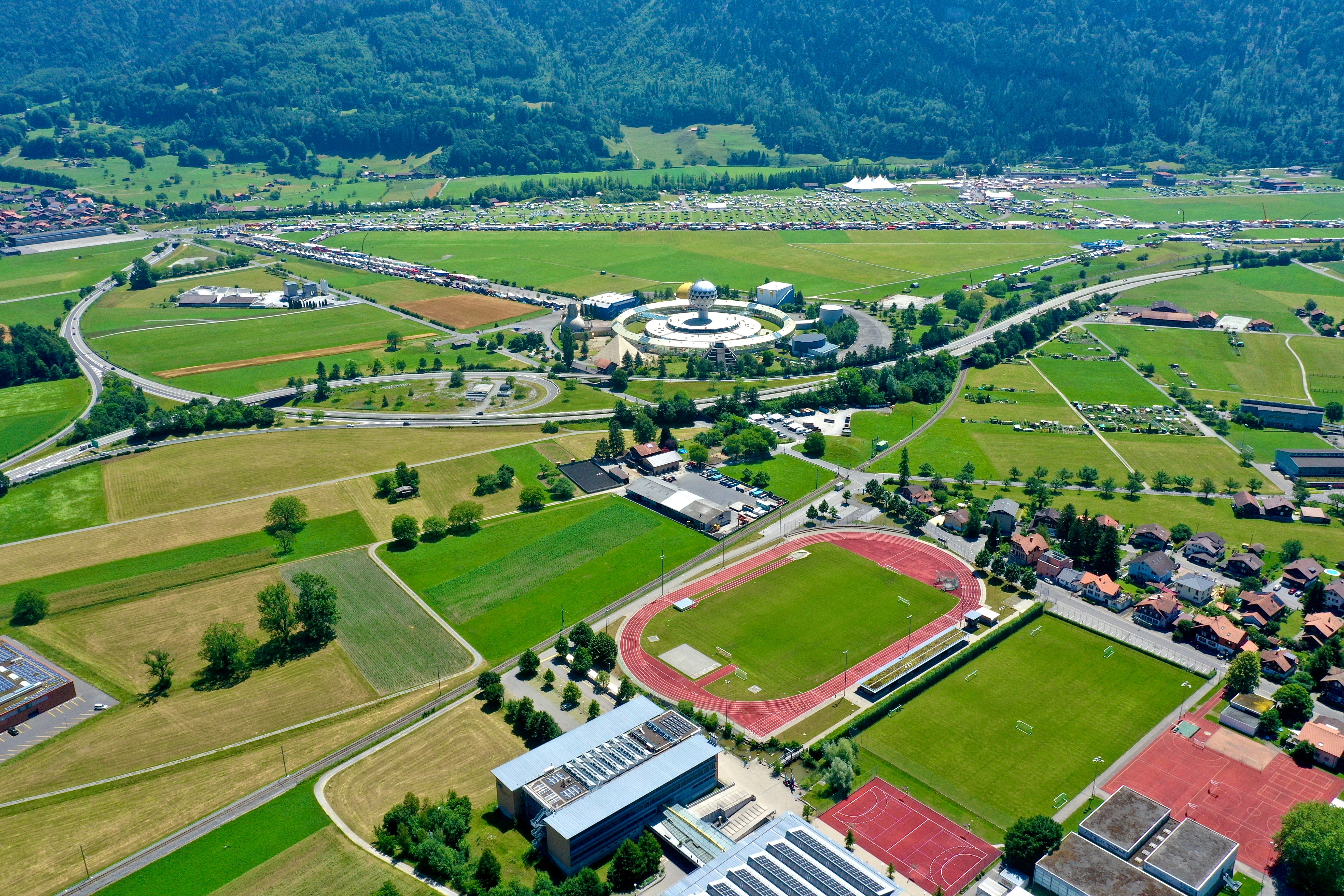 Aerial View of Swiss Rural Landscape and Stadium · Free Stock Photo