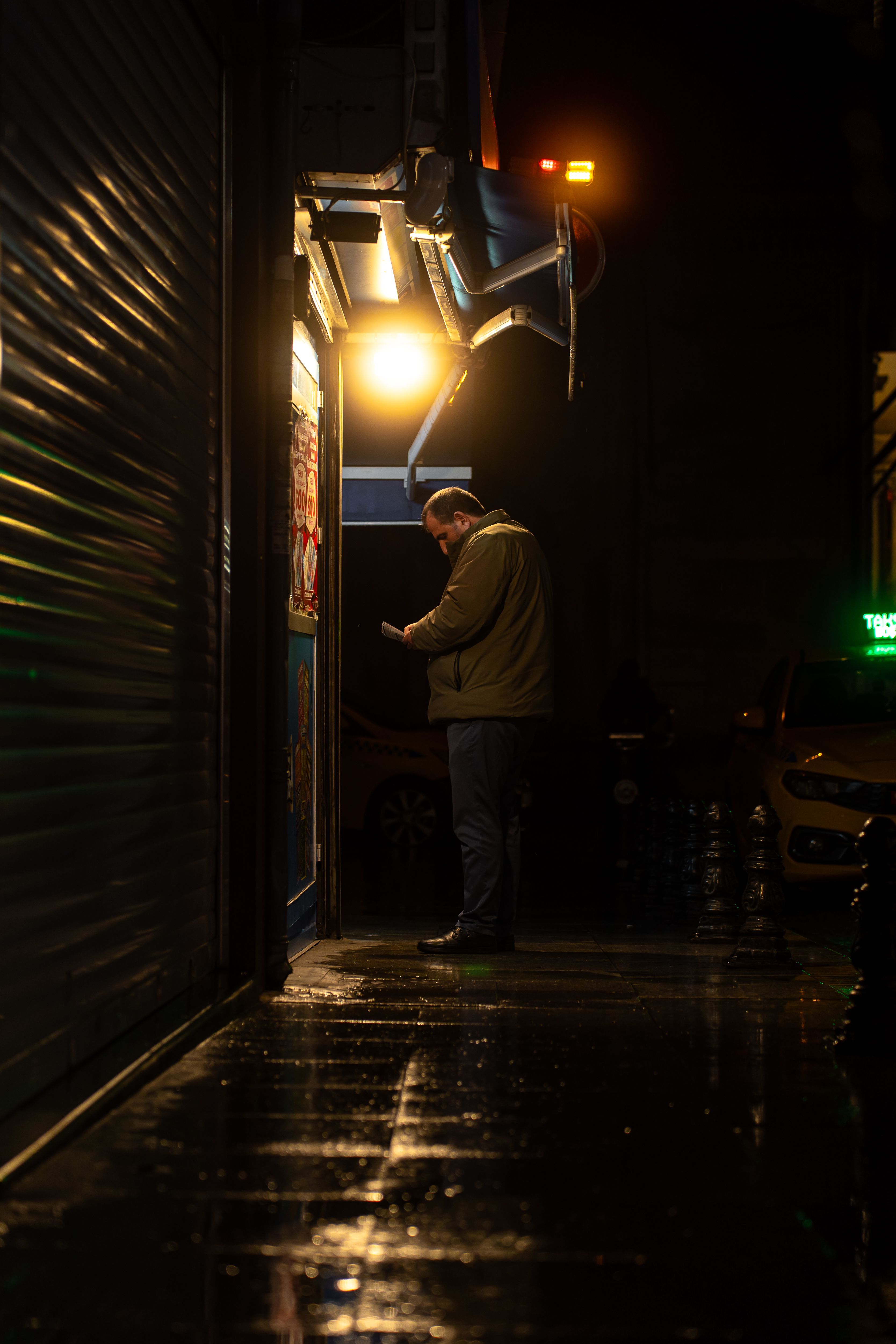 Man Standing Near Storefront at Night · Free Stock Photo