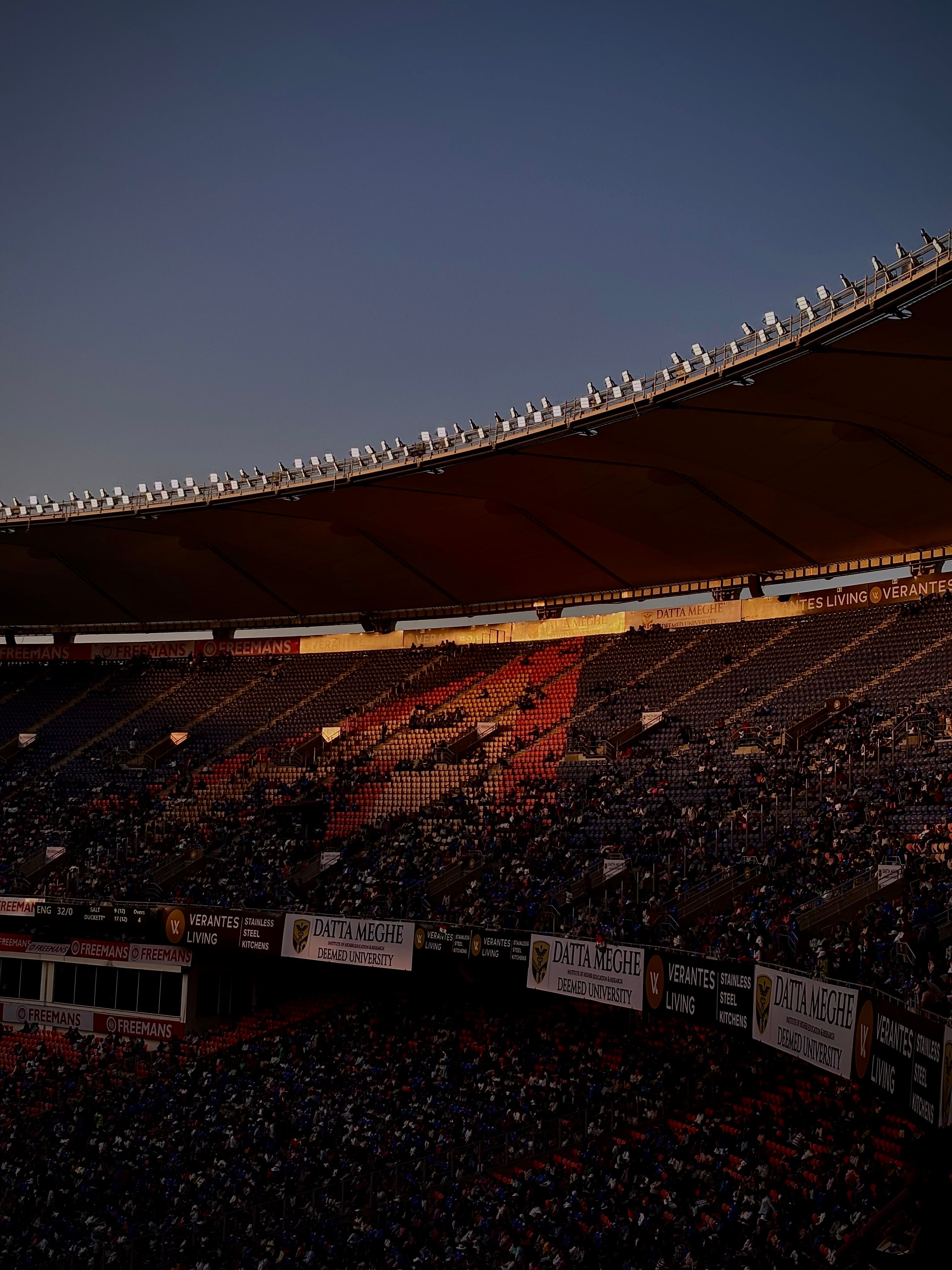 Large stadium at sunset with crowd · Free Stock Photo