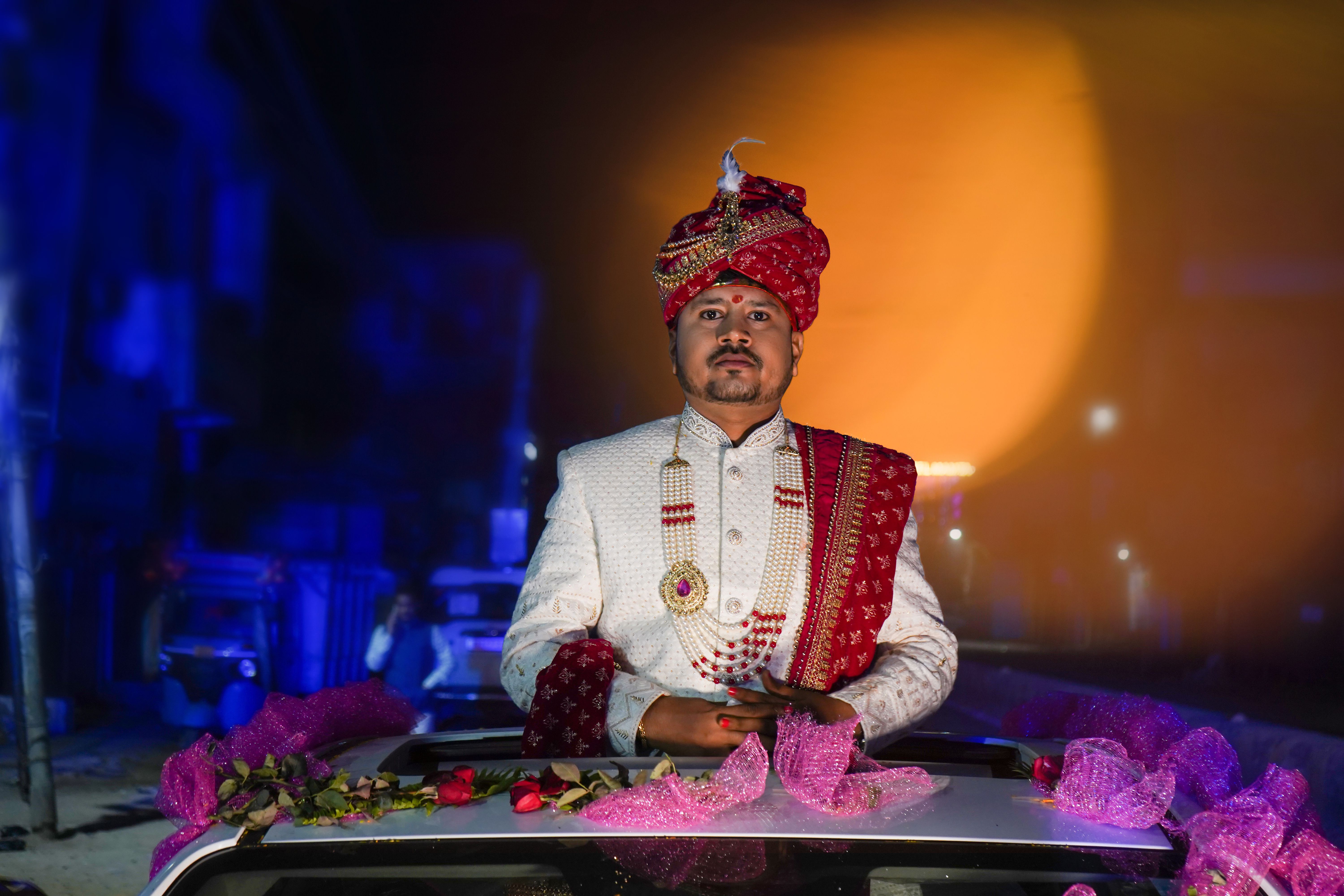 Traditional Indian Groom in Wedding Attire at Night · Free Stock Photo